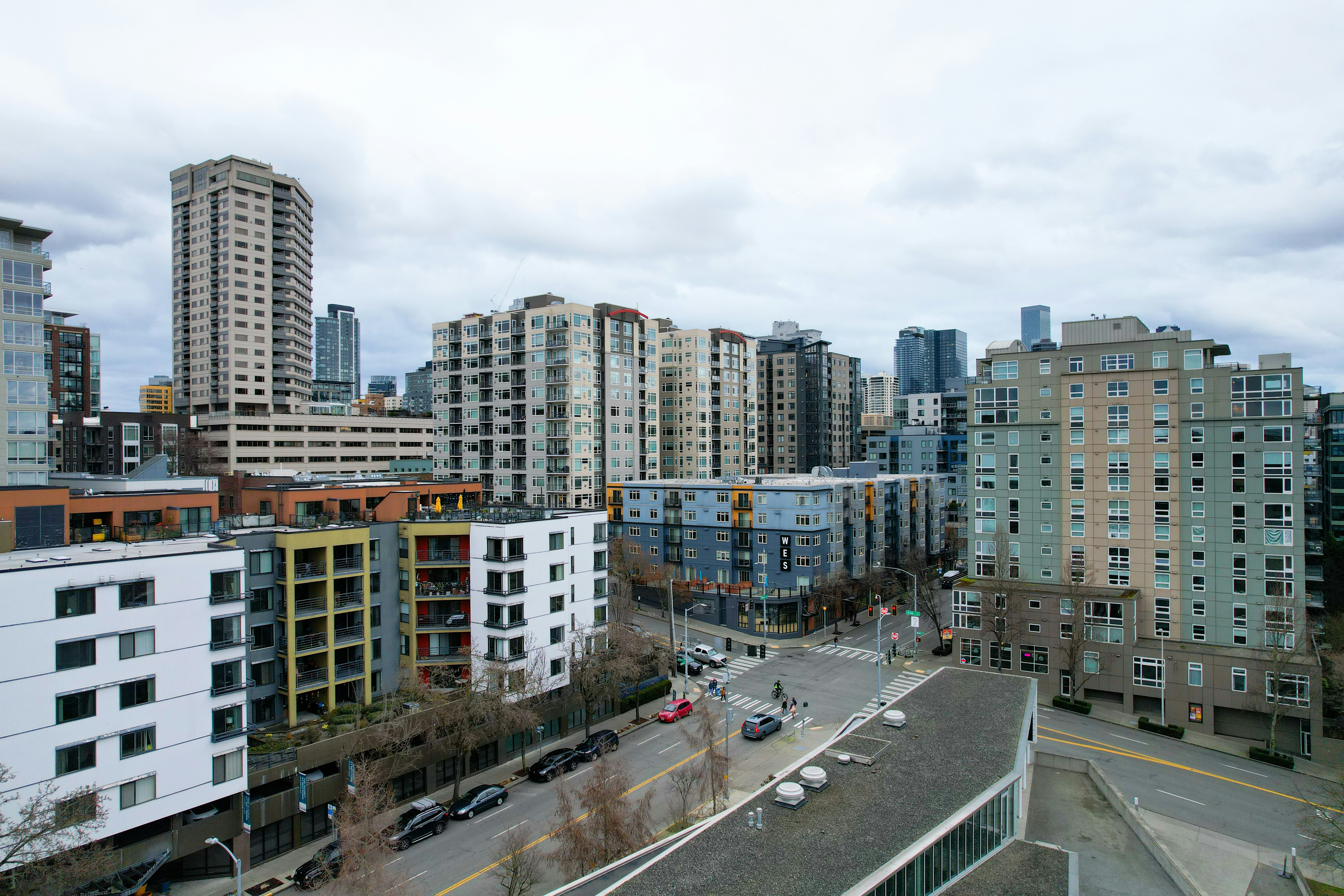 High-rise buildings and city streets under a cloudy sky in Seattle.