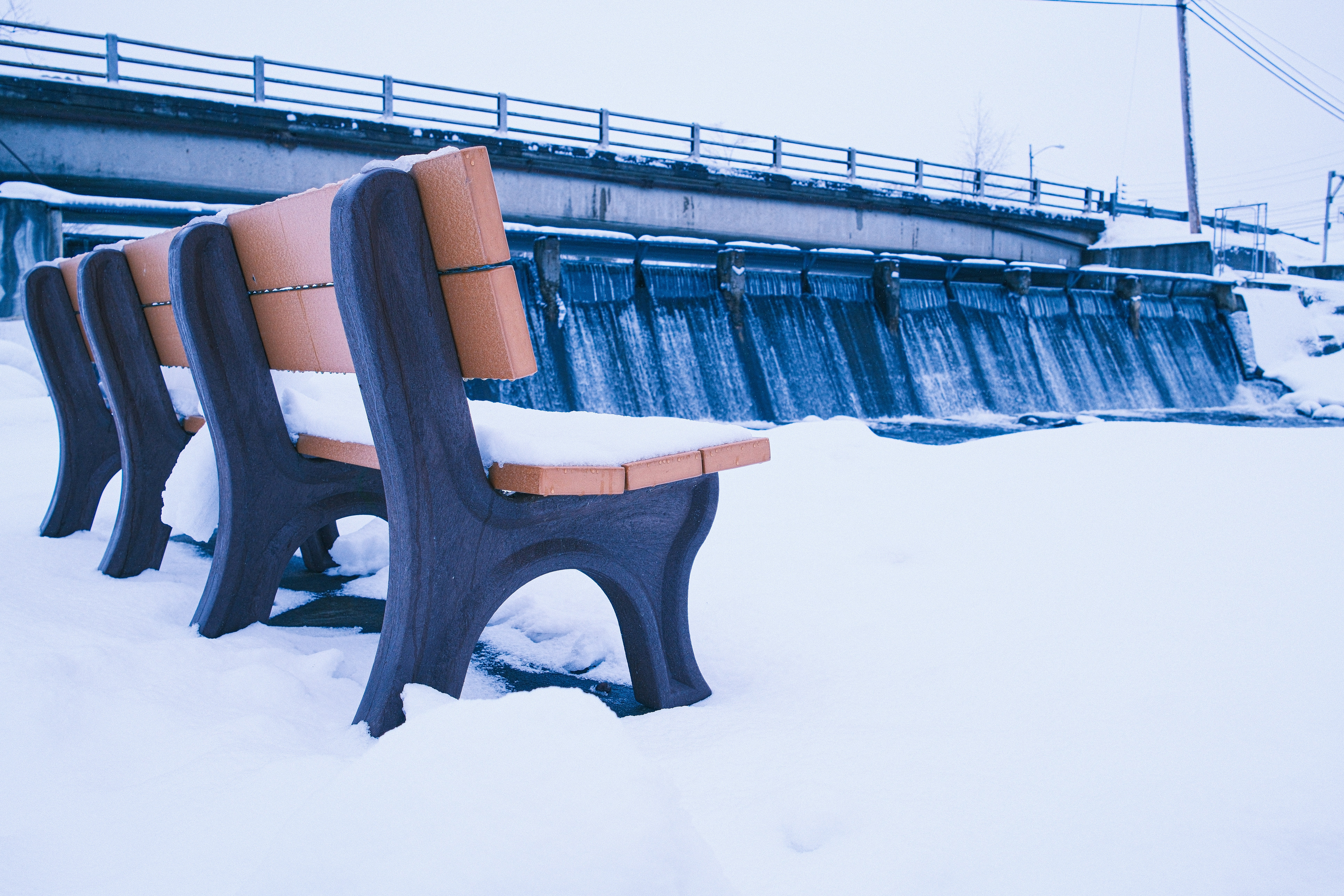 Silent Benches by the Winter Cascade