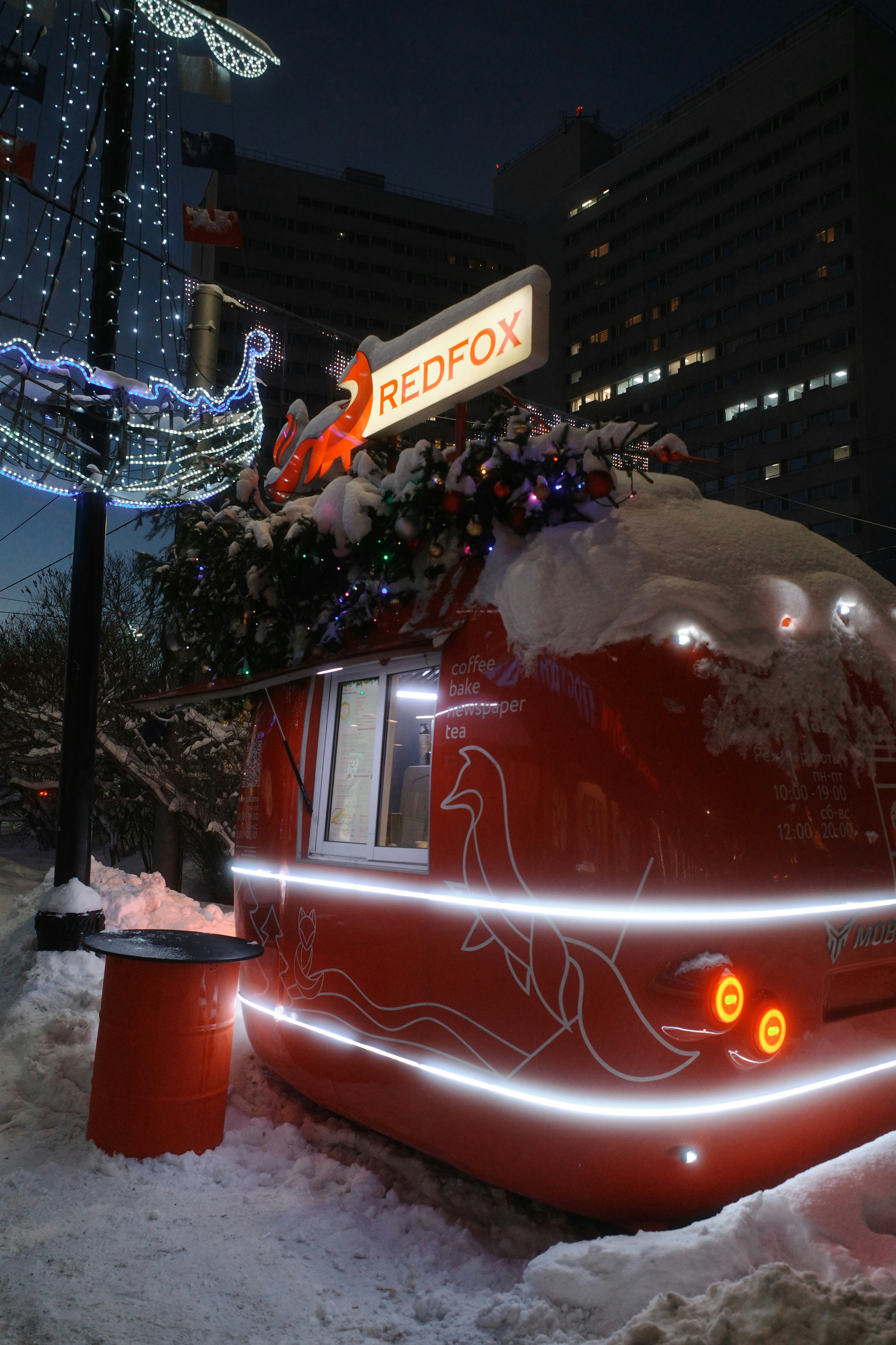 Red Fox Café at Night: Neon Snow Drifts and a Glowing Carriage