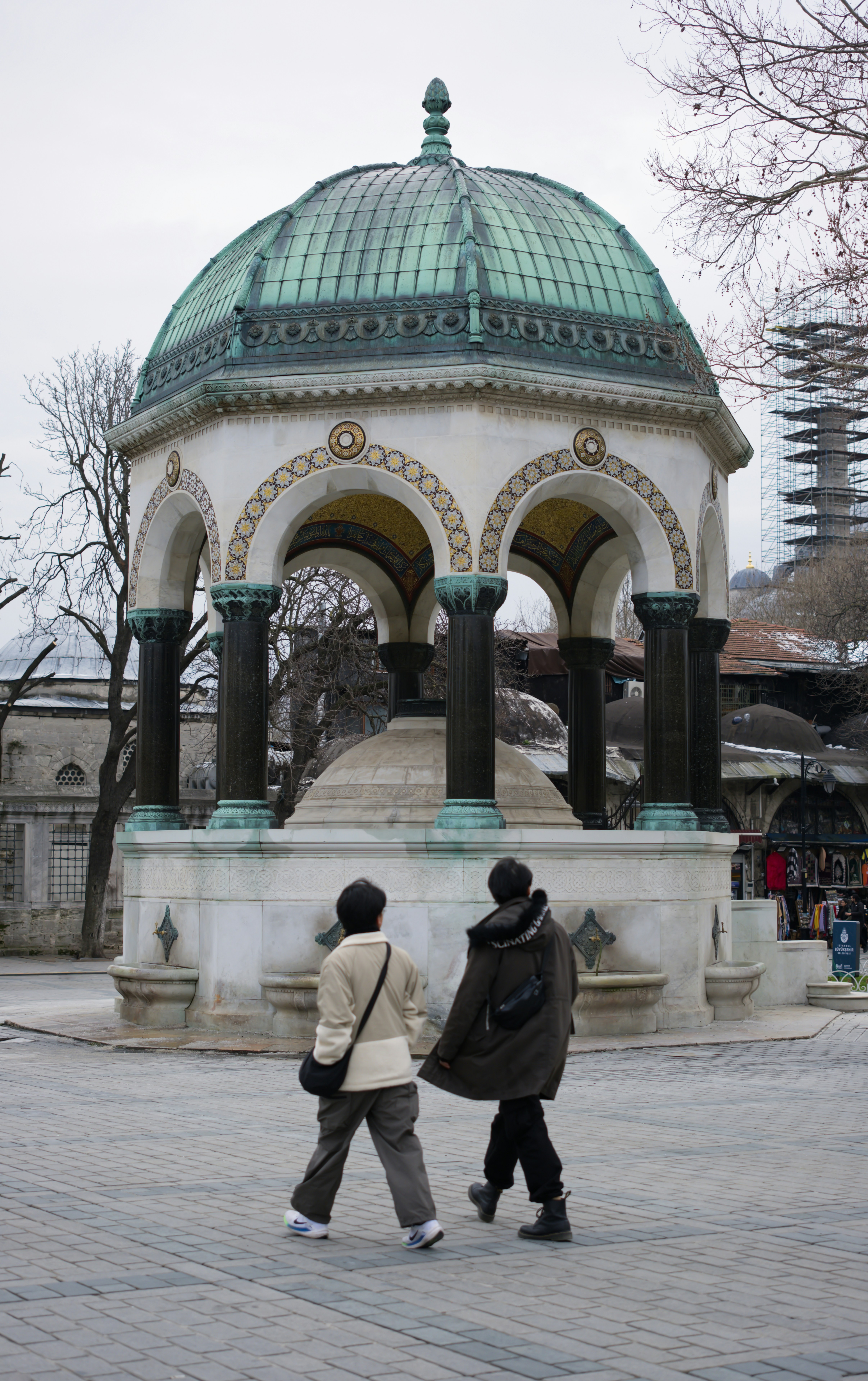 Copper-Domed Pavilion under Arched Vaults: Two Walkers in a Quiet City Square