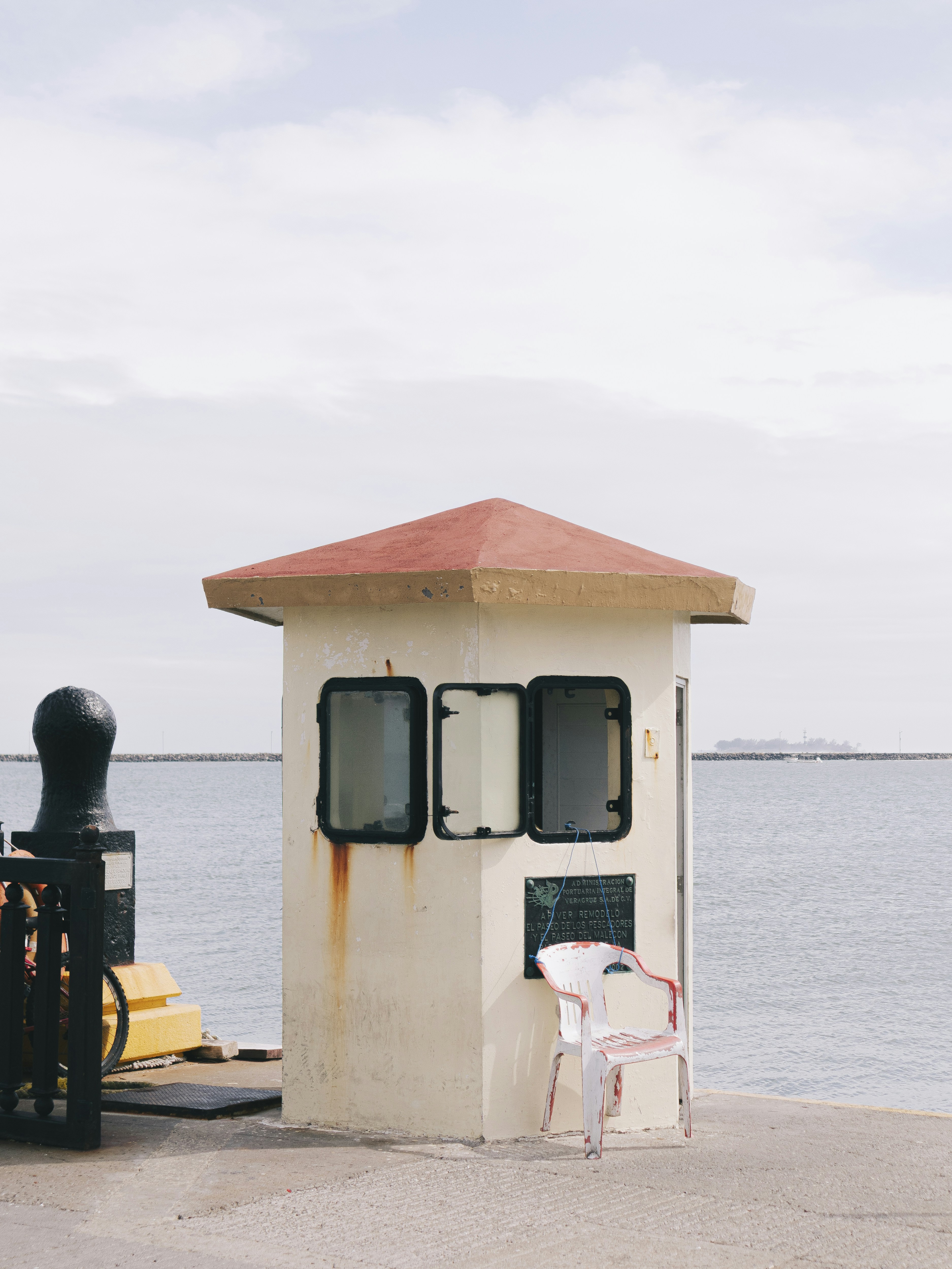 A coastal guard booth sits next to the ocean. photo – Free Sea Image on ...