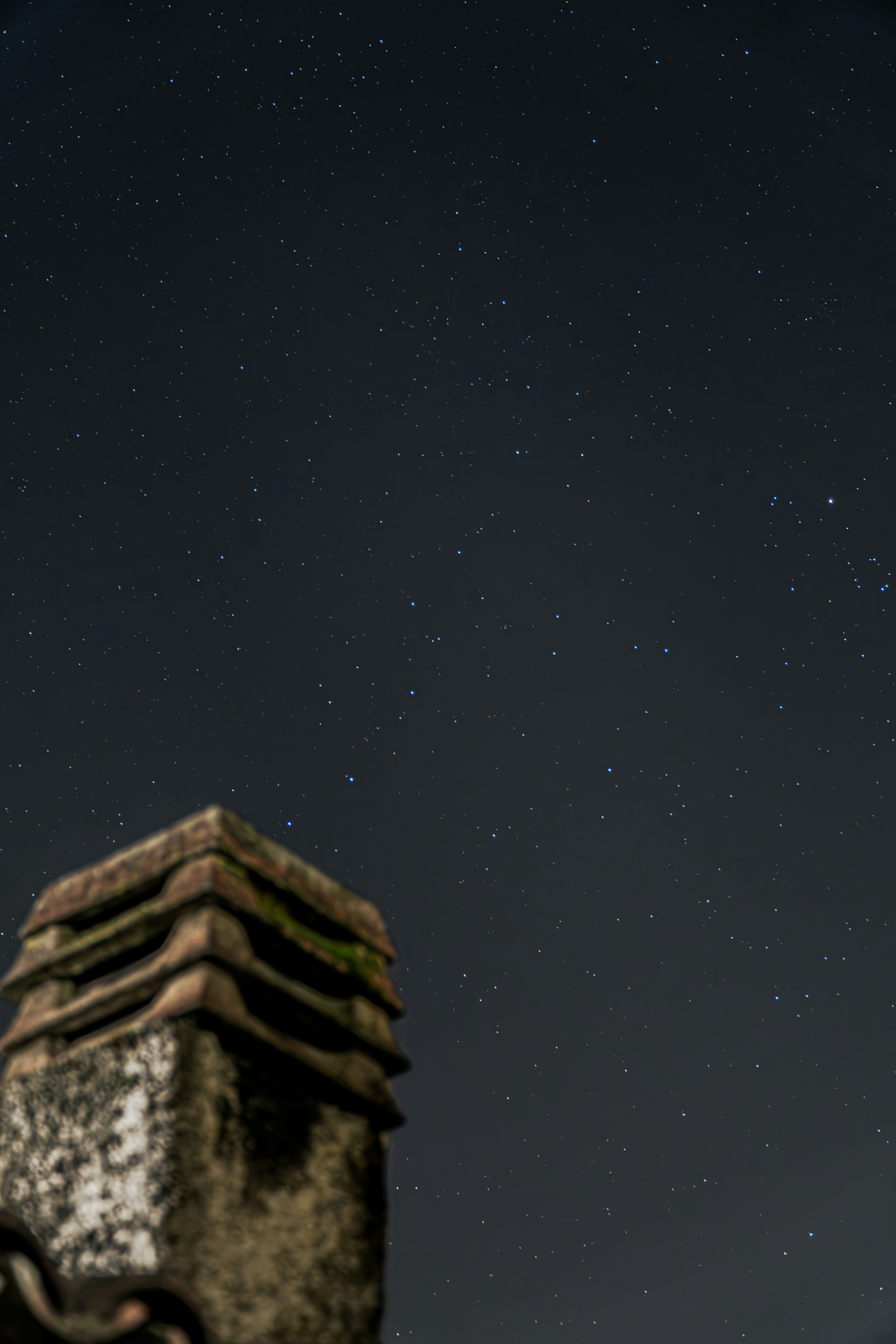 Chimney Silhouette Beneath a Milky, Starry Night