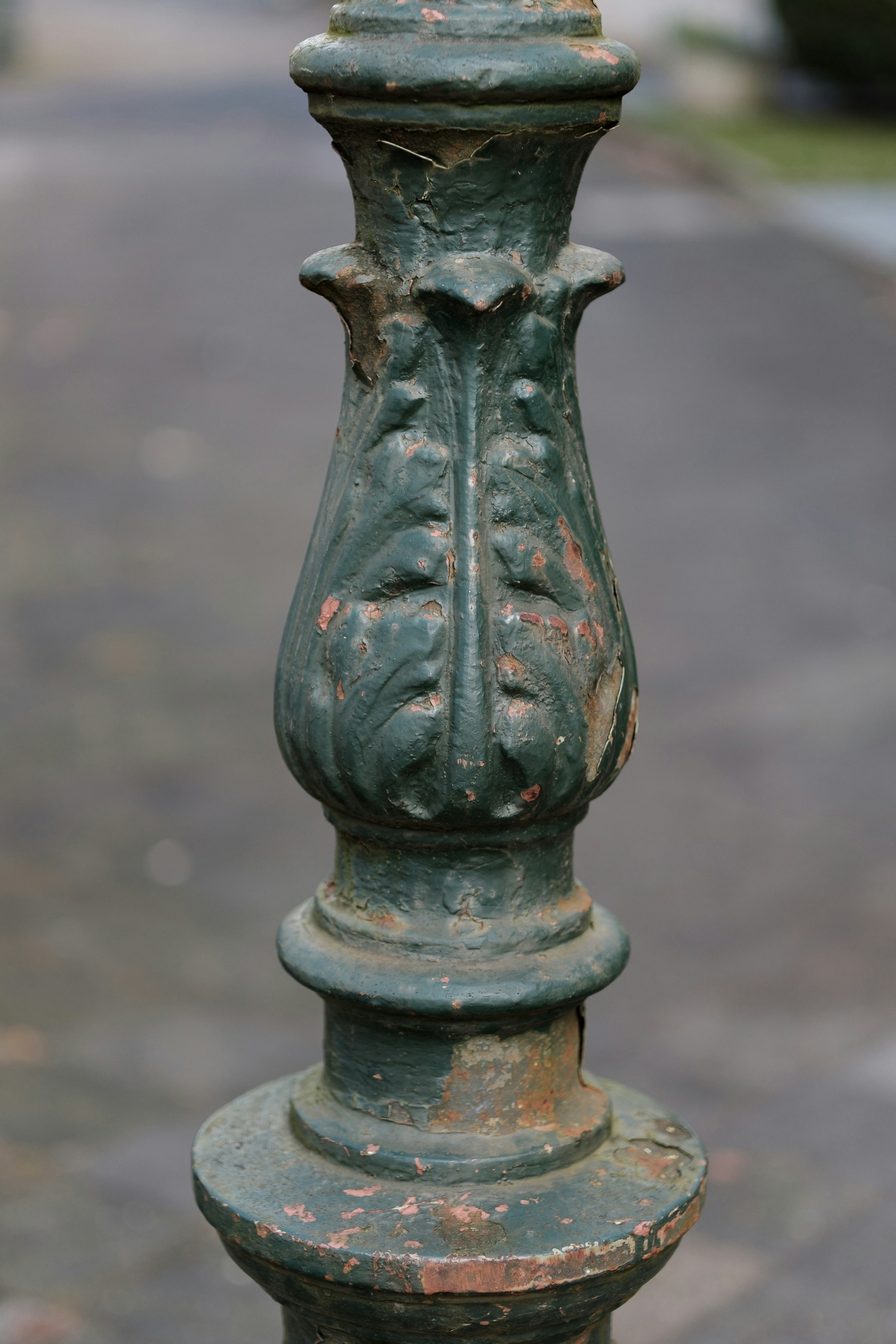 Ornamental metal post shows beautiful detailing and aged paint. photo ...