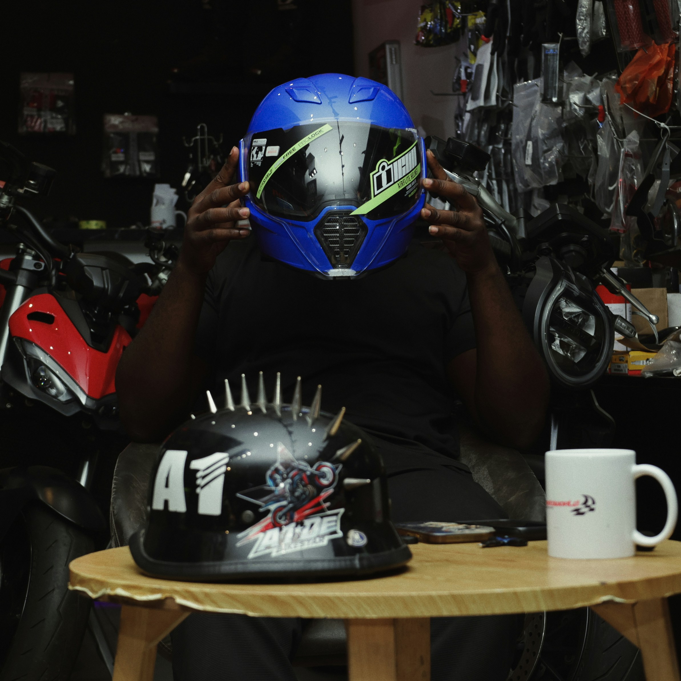 Blue Helmet and Spiked Foreground: A Quiet Moto-Shop Portrait