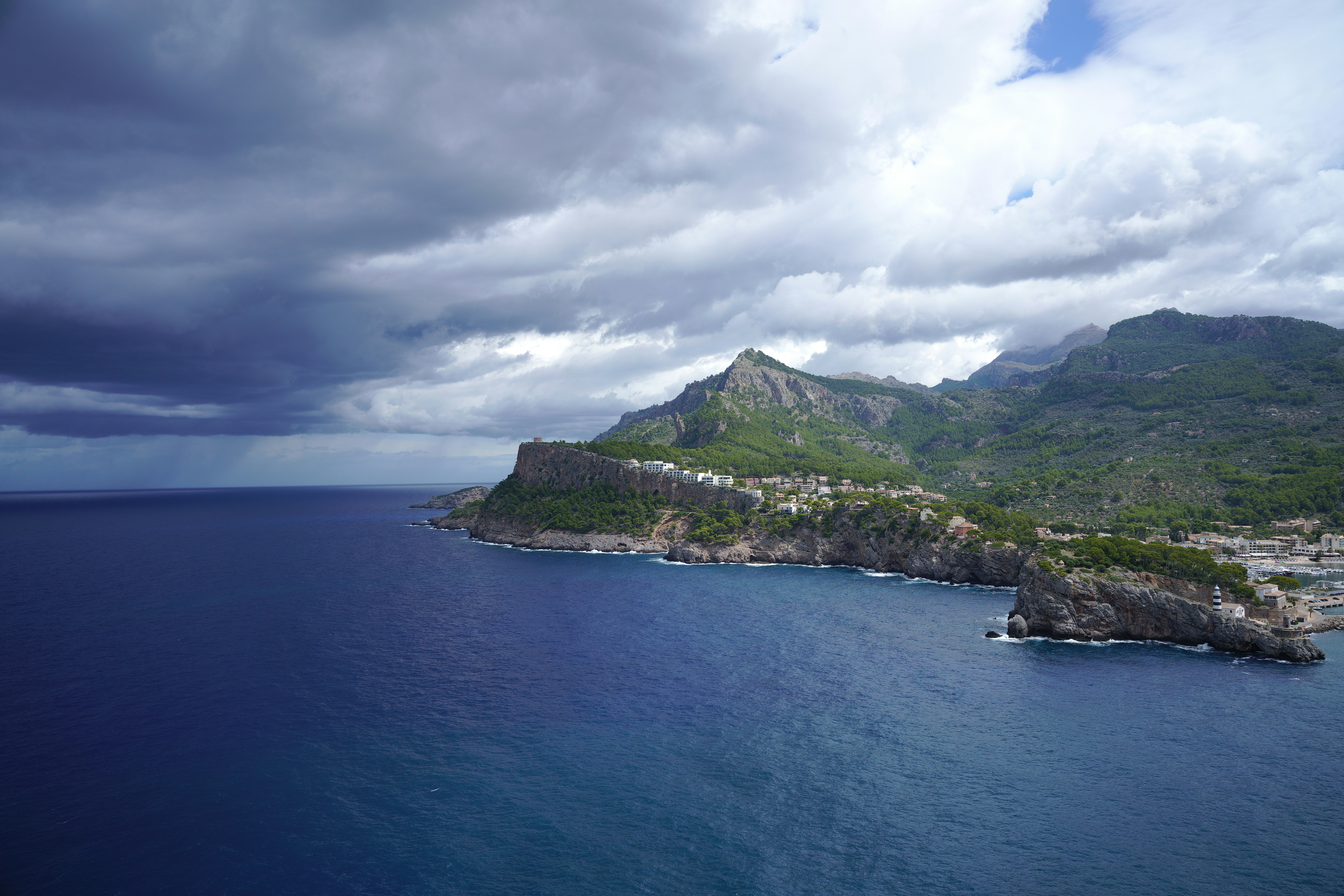 Stormy Coastline and Verdant Peaks