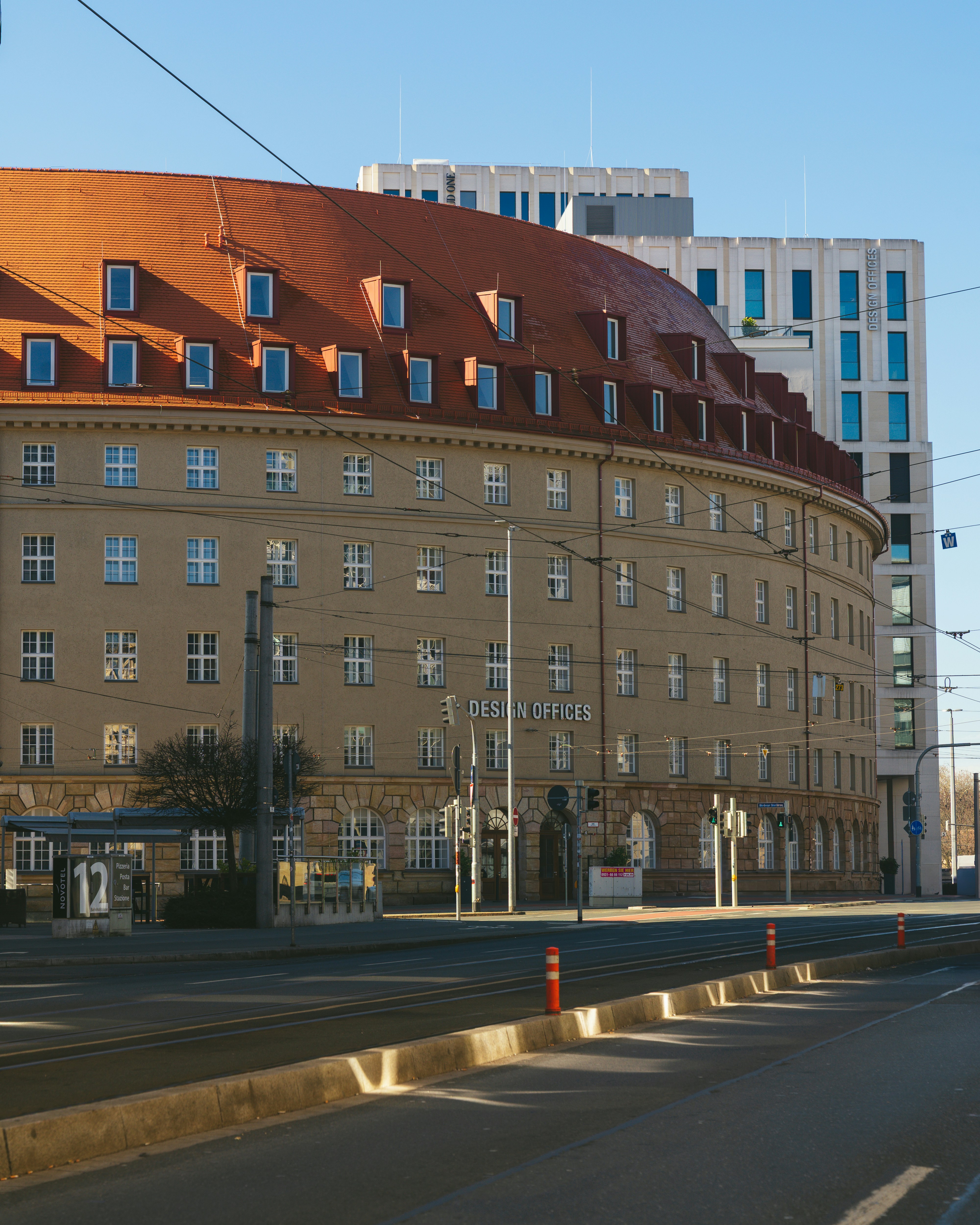The Brick Arc: Sunlit Curve Over a Quiet City Street
