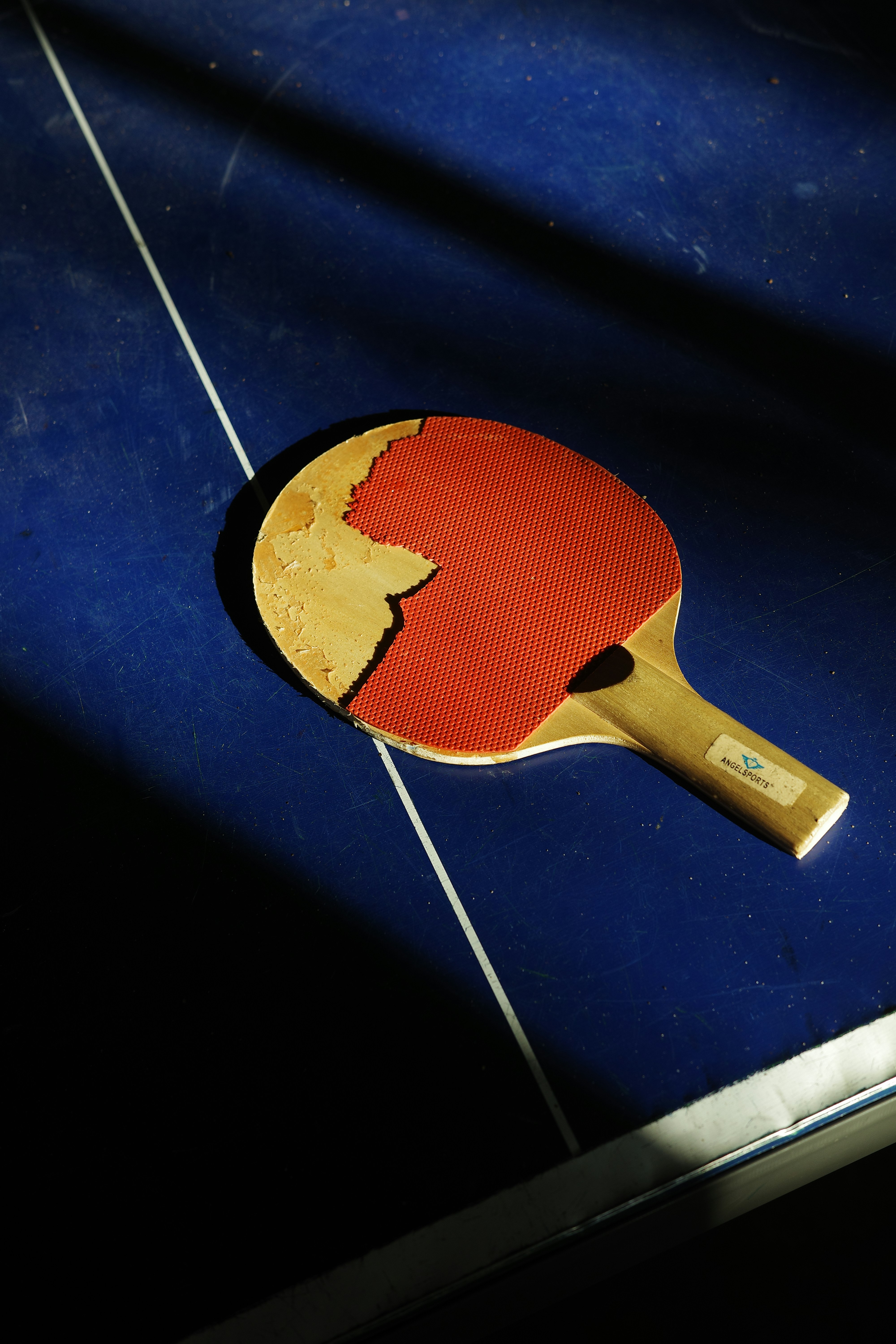 Broken ping pong paddle on a blue table. photo – Free Pingpong Image on ...