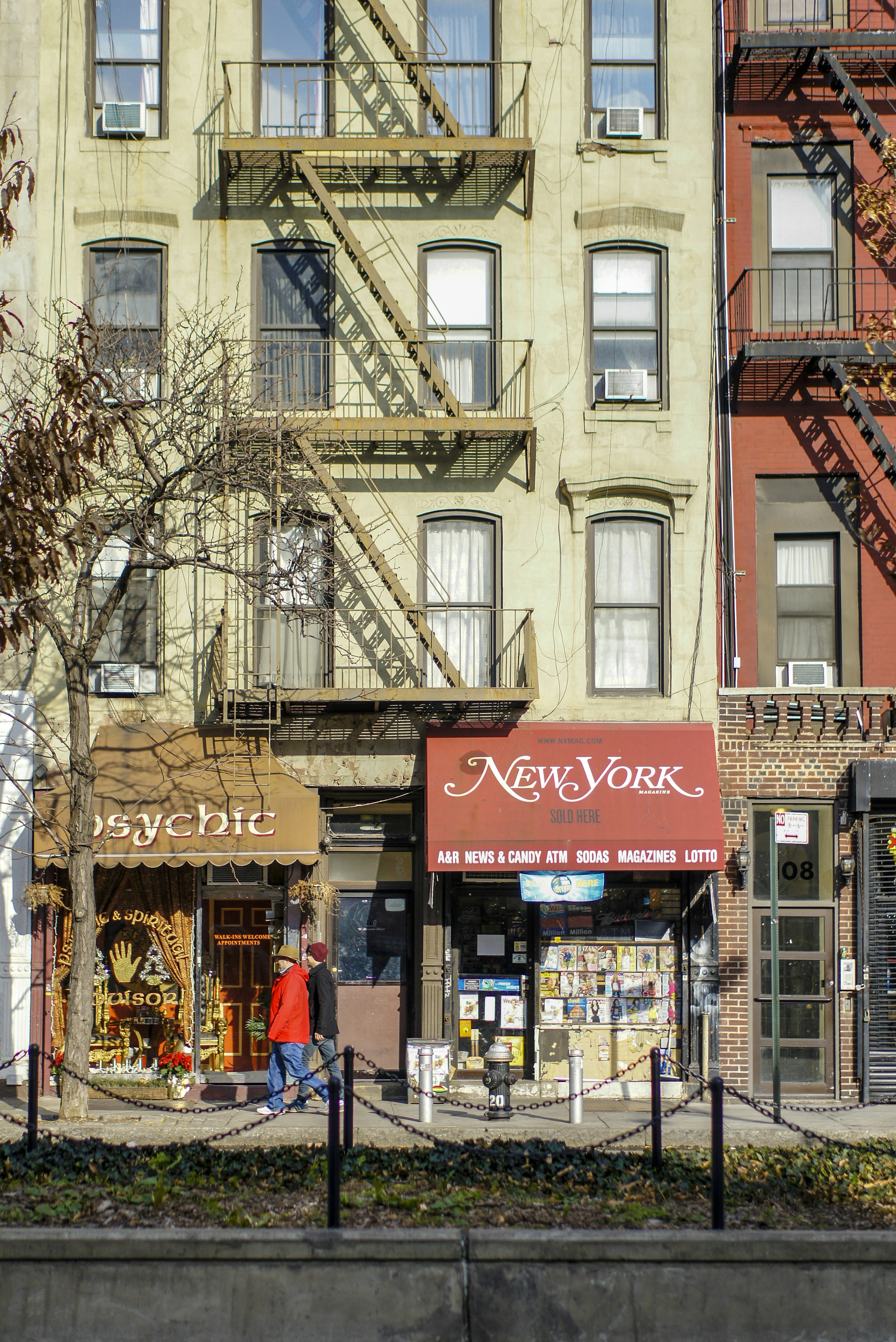 Shops are under buildings with fire escapes. photo – Free New york ...