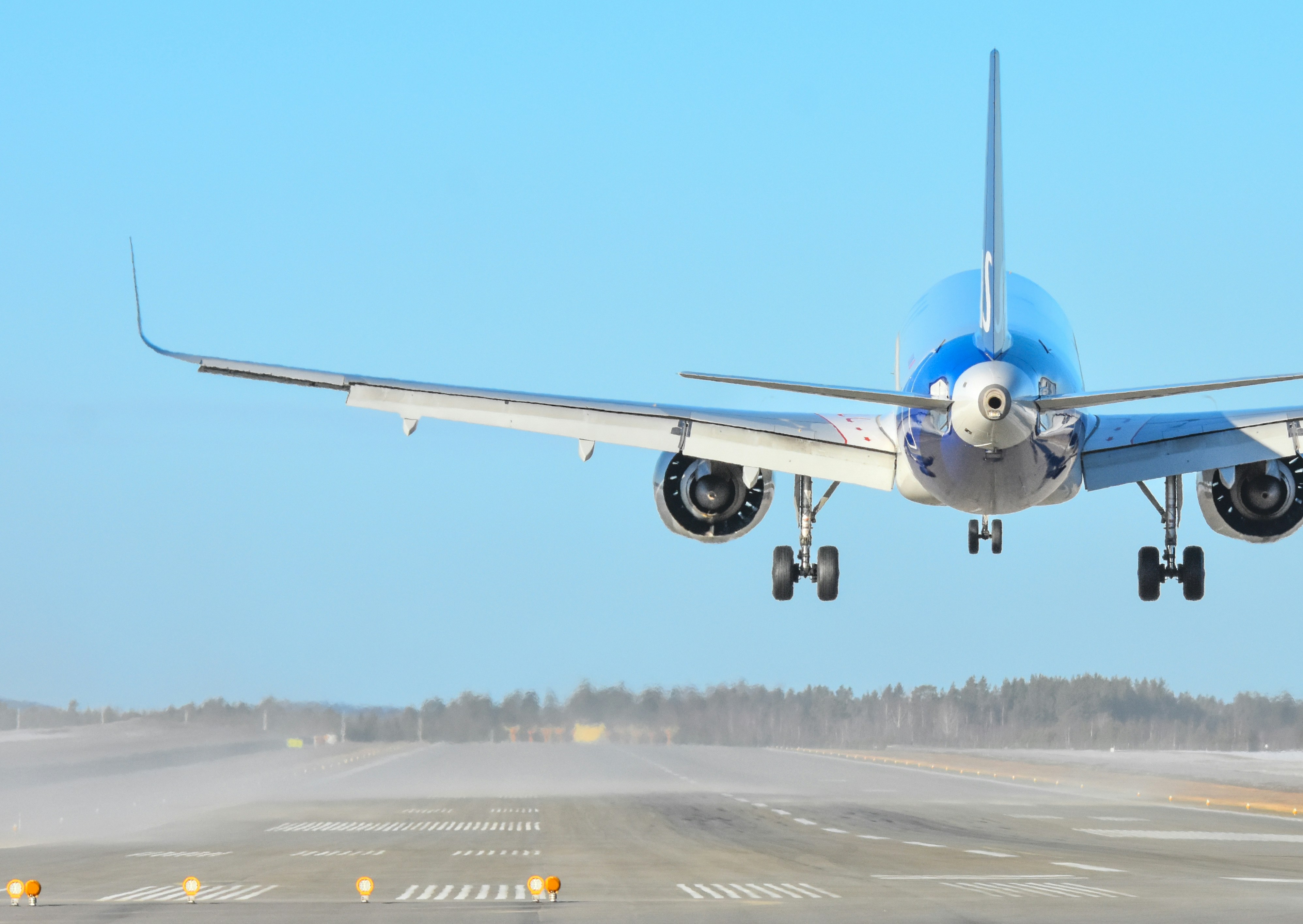 Airplane is about to land on a runway. photo – Free Airplane Image on ...
