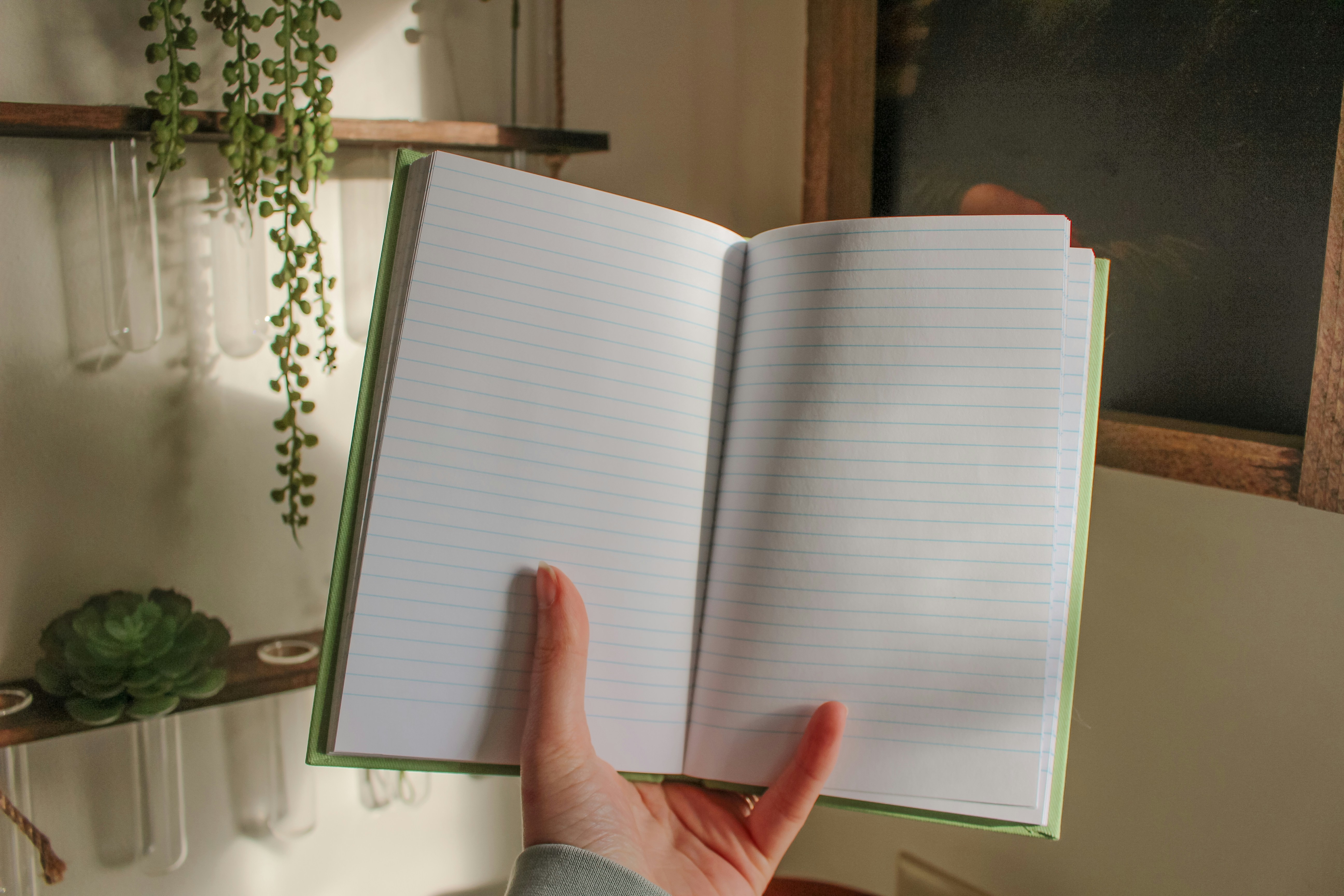 An open notebook is held in front of the camera. photo – Free Office ...