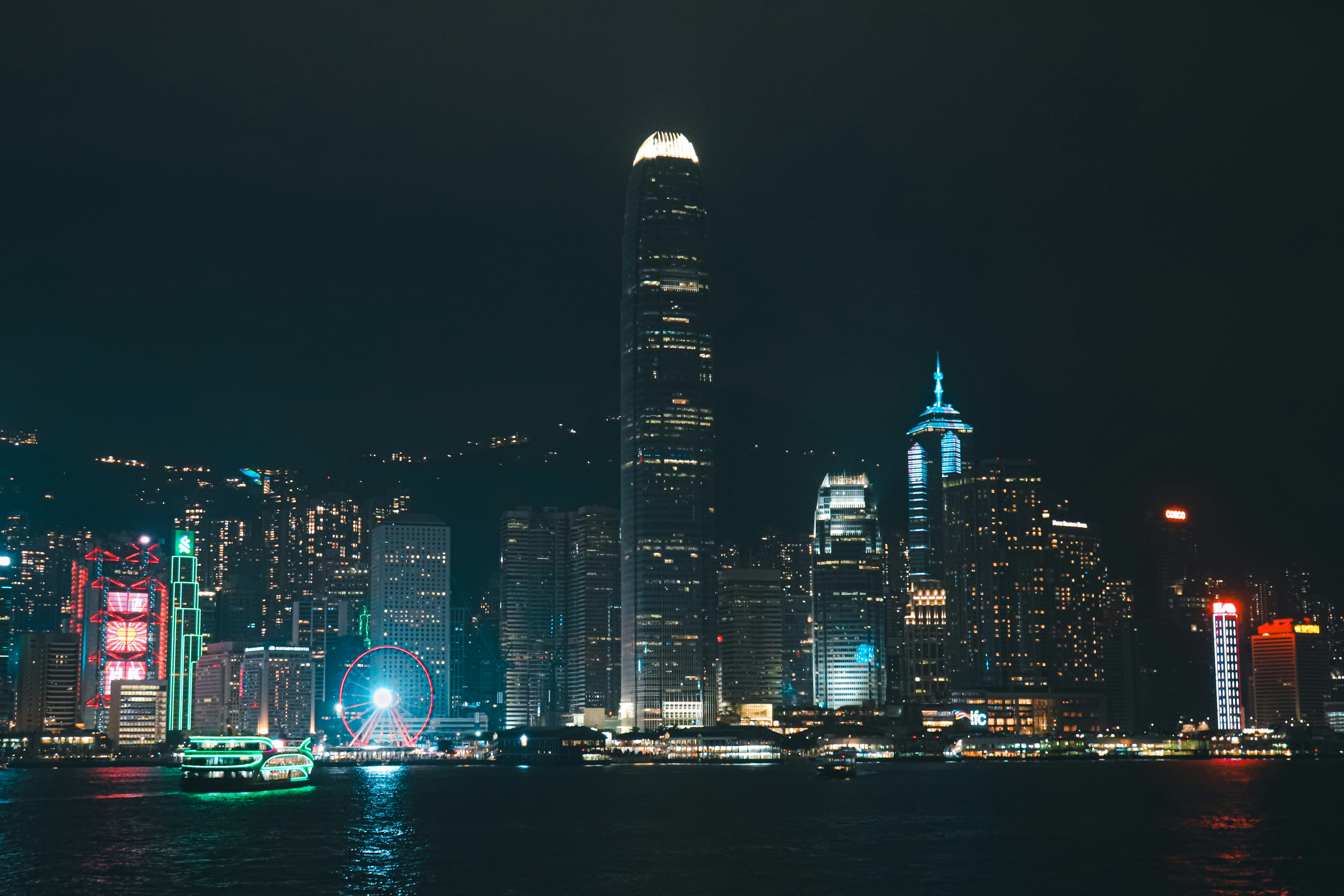 Nighttime skyline of a city with illuminated buildings. photo – Free ...