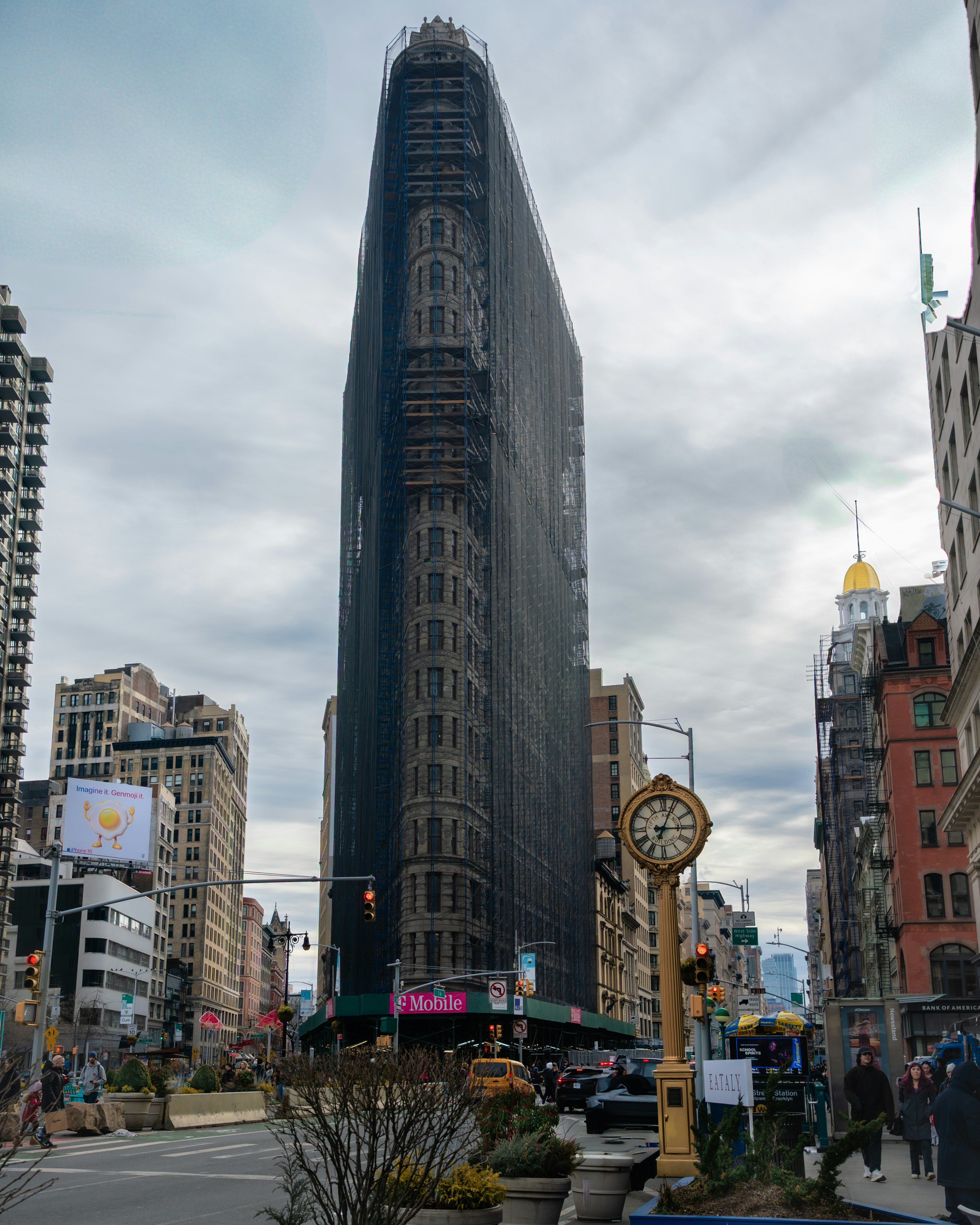 Silhouette in Steel and Time: A Scaffold-Wrapped Tower Over a Clock-Lined City Square