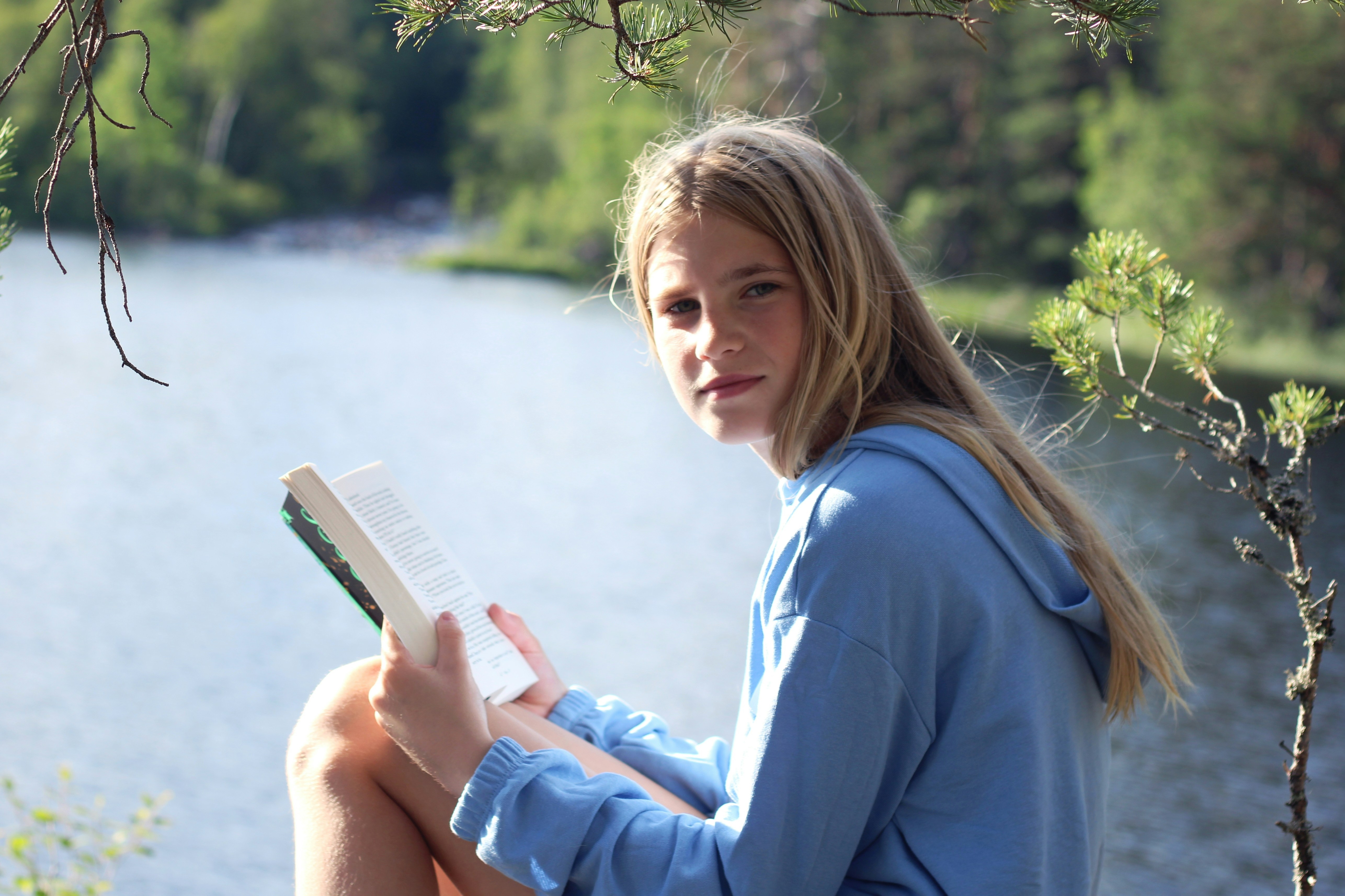 Young woman reads a book by the lake. photo – Free Reading Image on ...