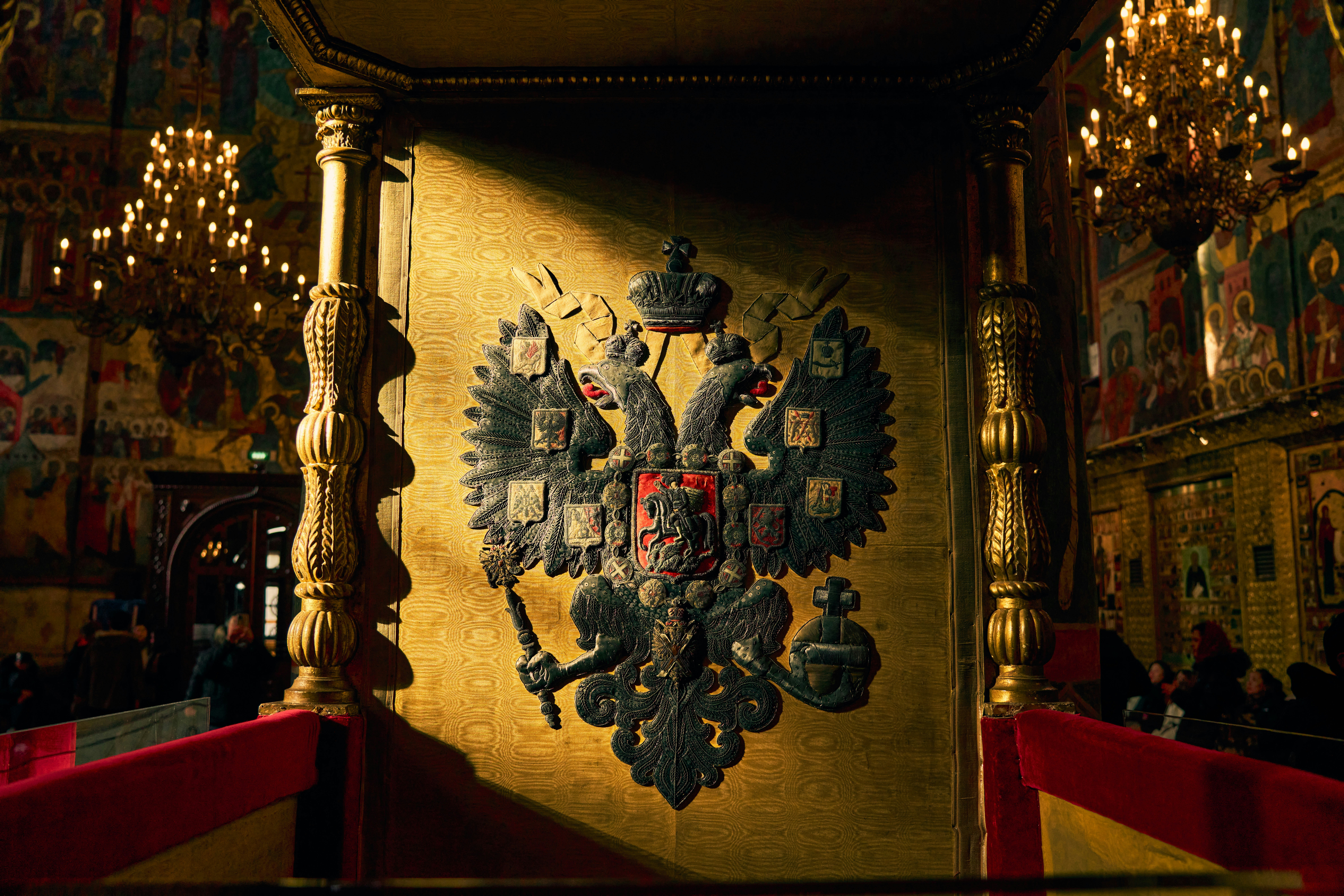 Gilded Crest in Candlelight: A Central Emblem in a Sanctified Hall