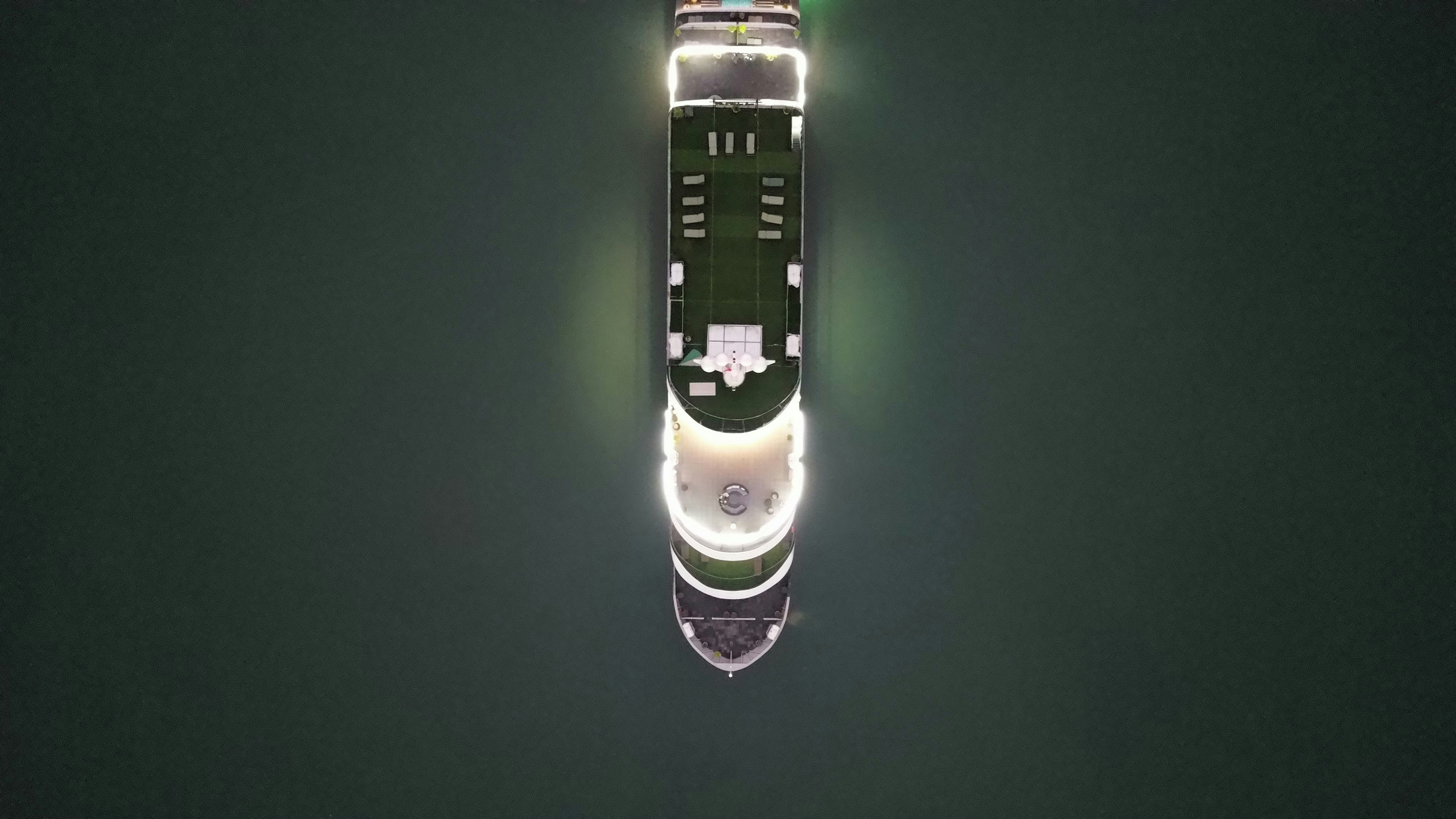 Nocturnal Voyage: Illuminated Elegance Afloat