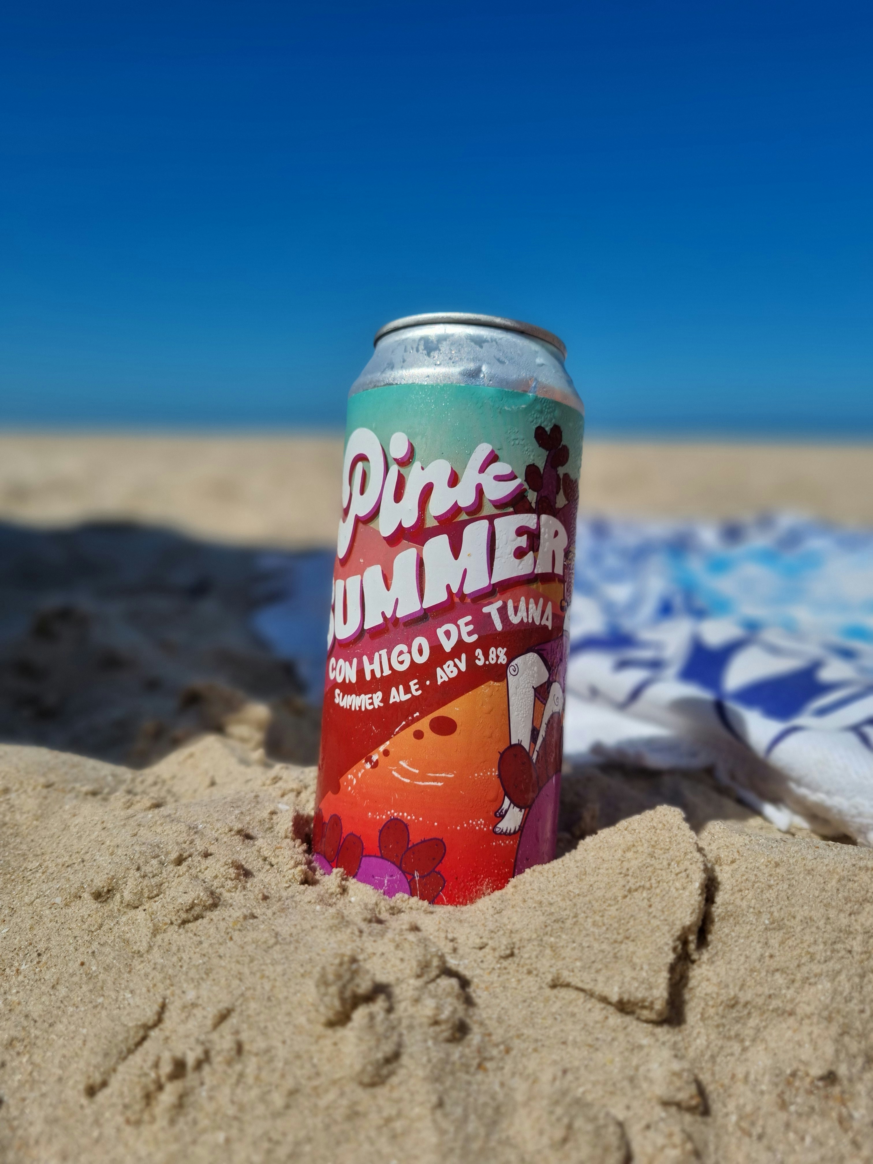 Pink Summer Buried in Sunlit Sand on a Quiet Beach