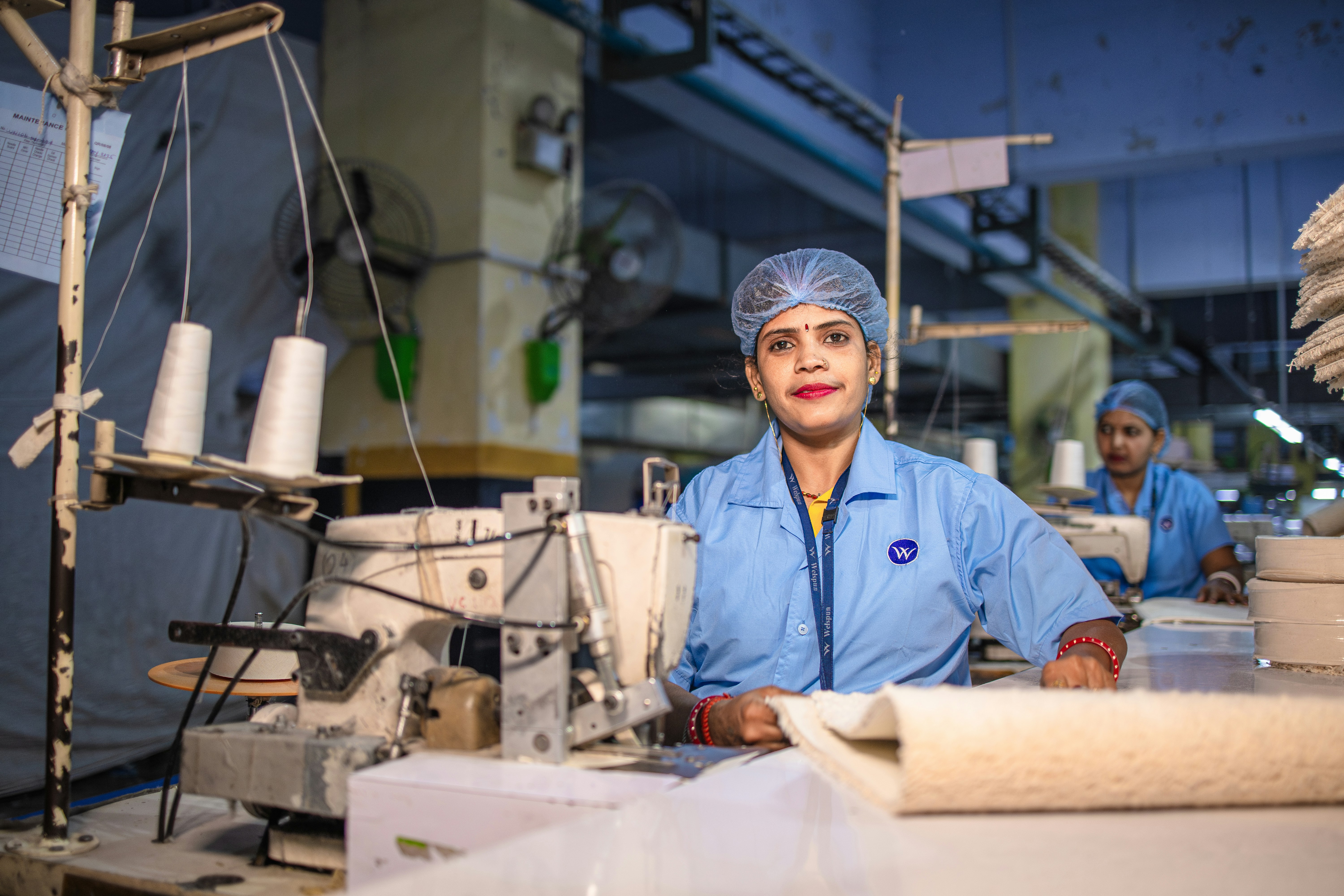Female workers operate sewing machines in a factory. photo – Free ...