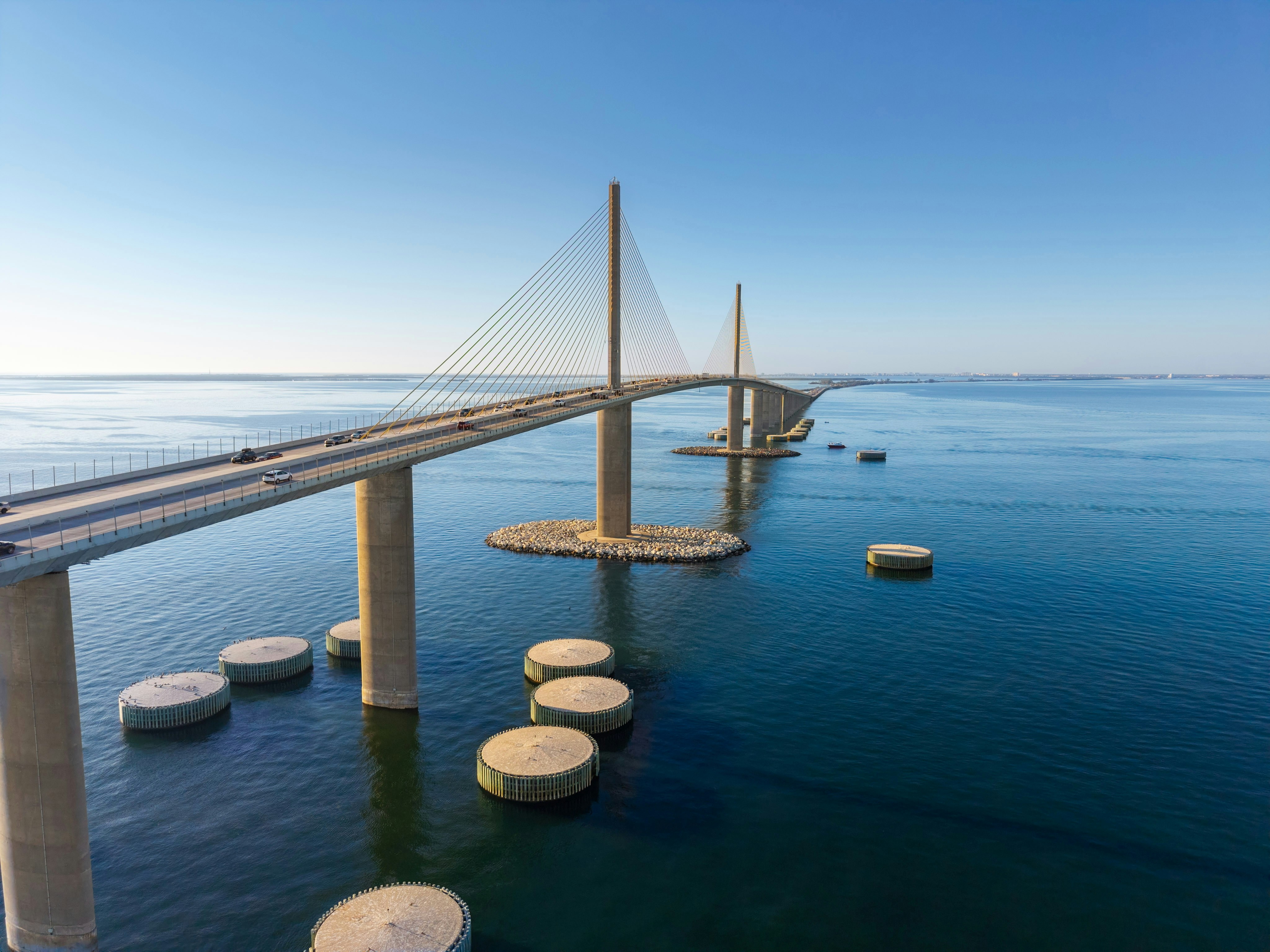 Sunshine Skyway Bridge extending over Tampa Bay with its elegant cable-stayed design and calm blue waters.