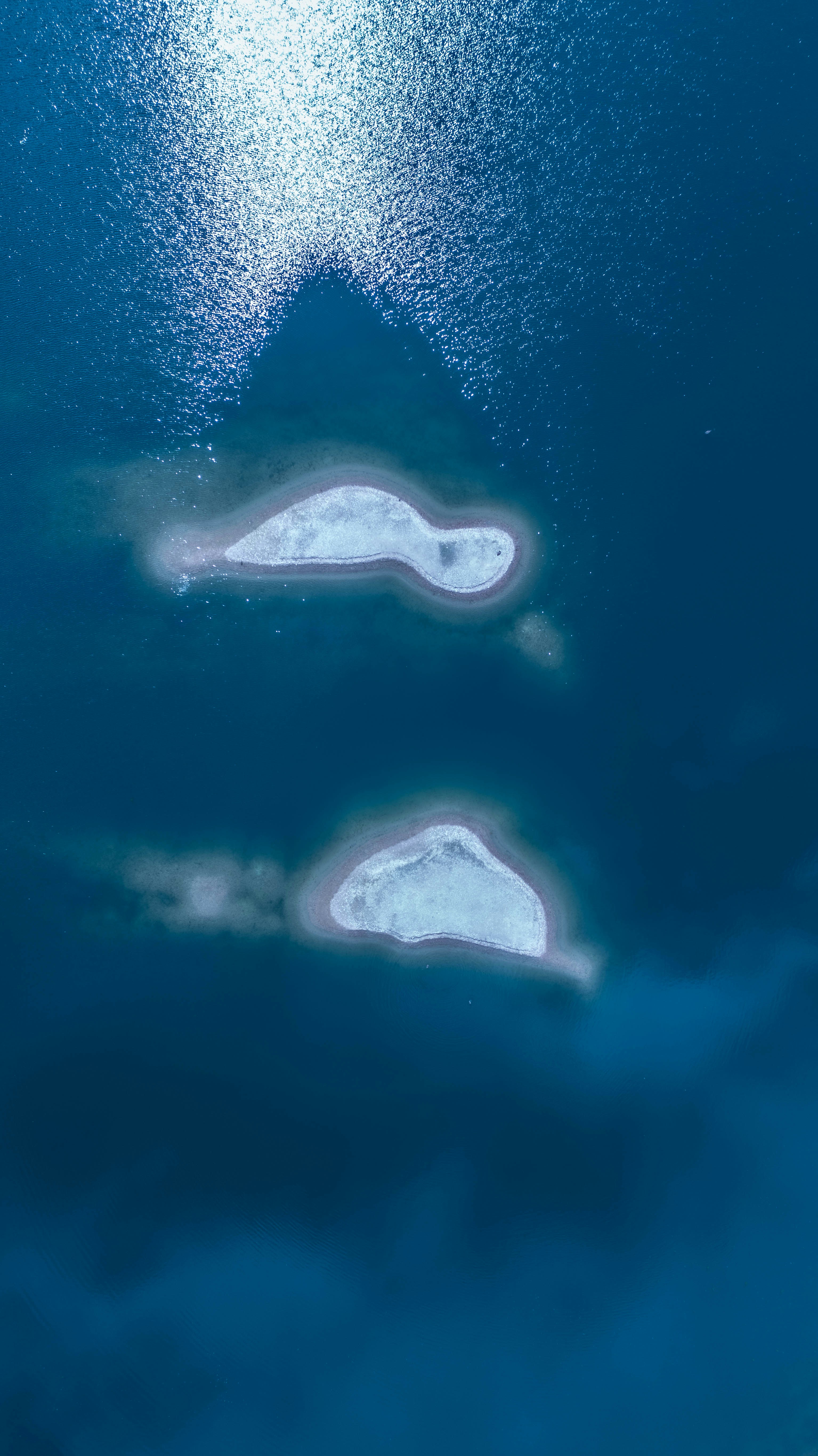 Twin Sandbars in a Sapphire Sea: An Aerial Study of Quiet Coastlines