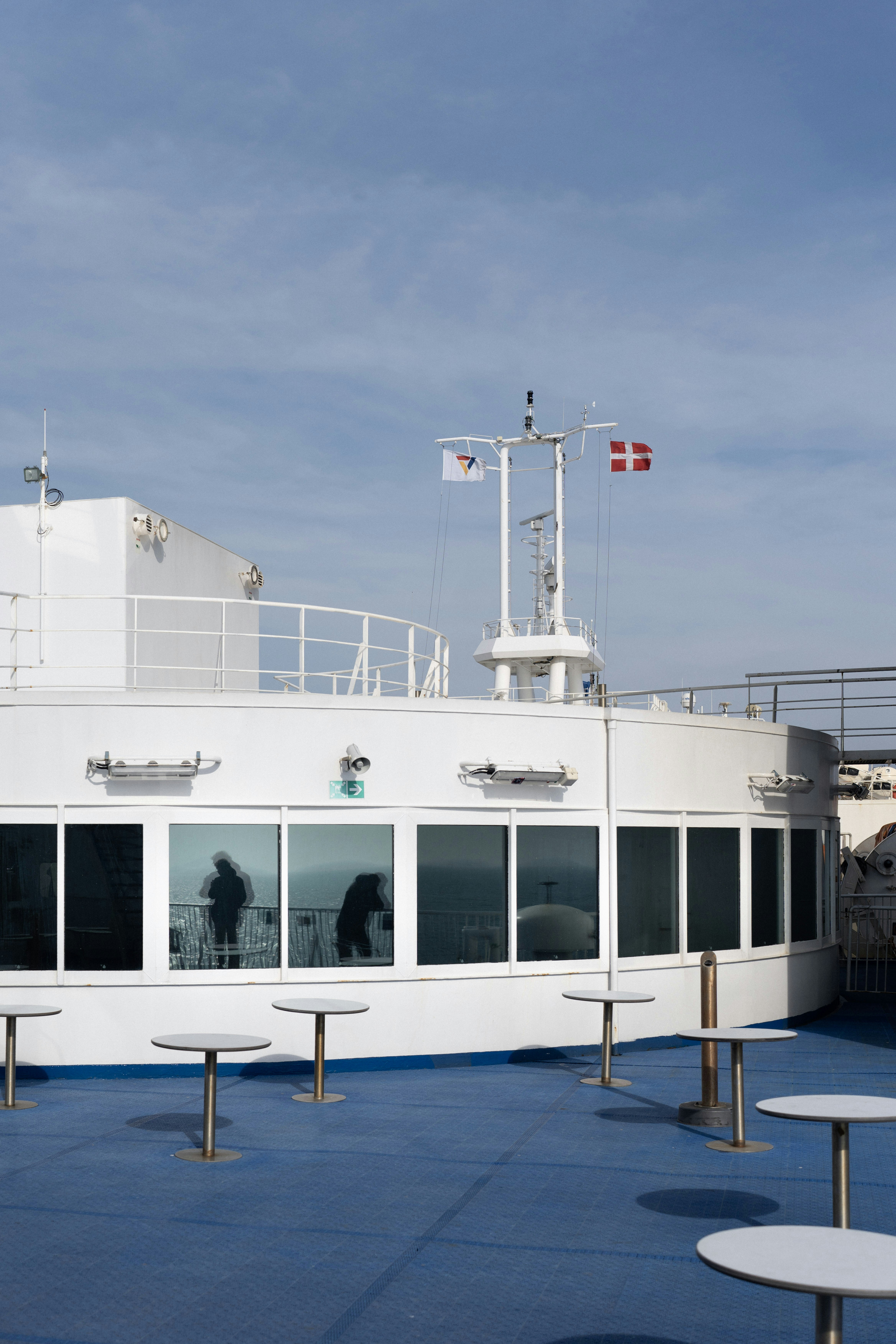 A white ship deck with flags on a clear day. photo – Free Deck Image on ...