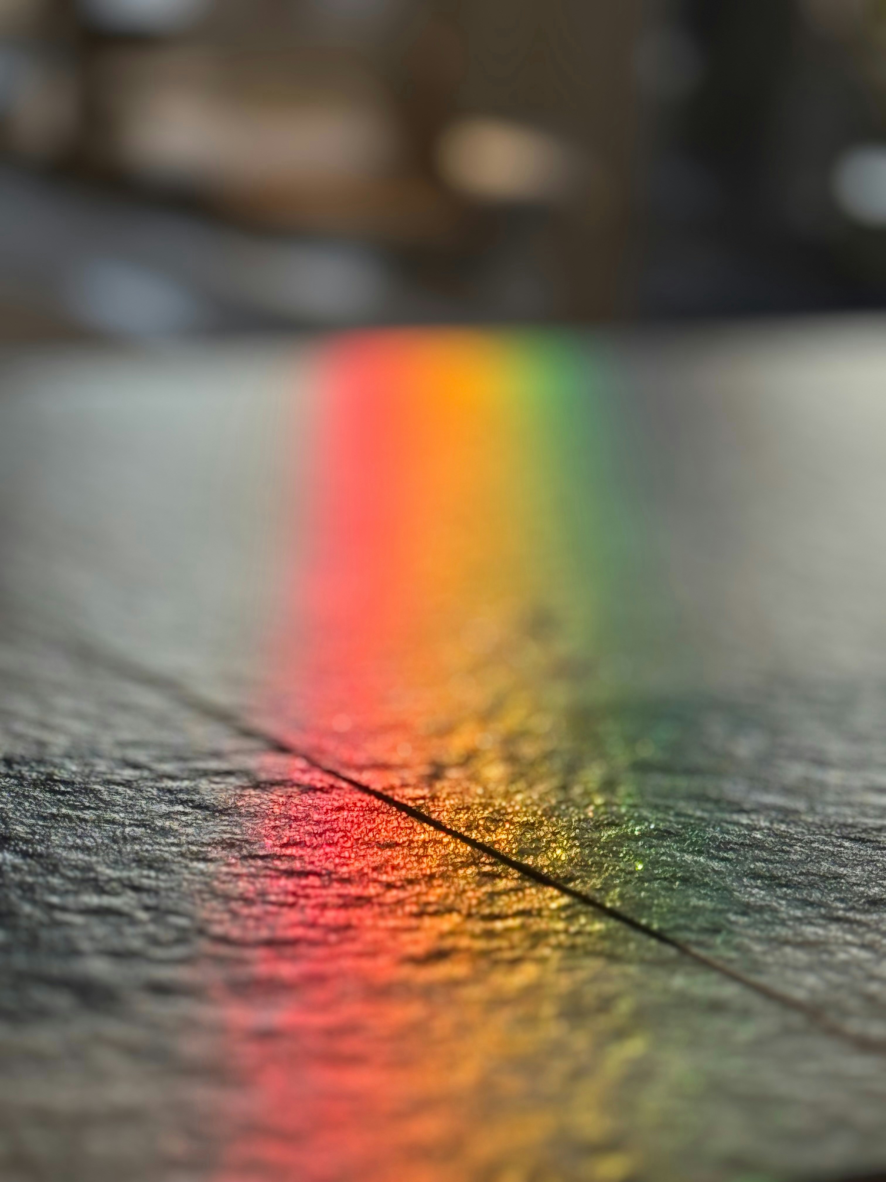 Rainbow Reflections Across a Weathered Surface