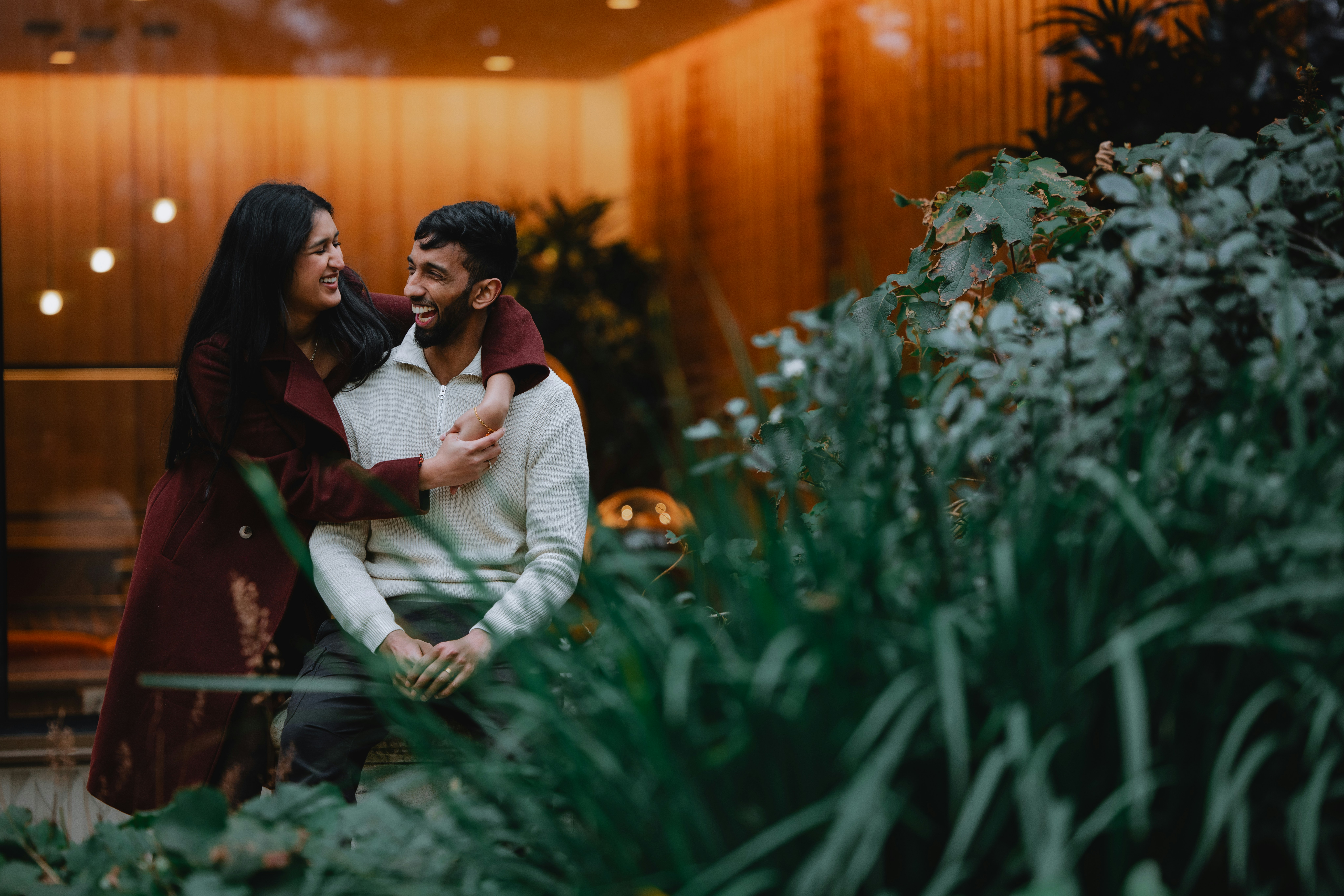Warm Embrace at Dusk: A Couple in Soft Garden Glow