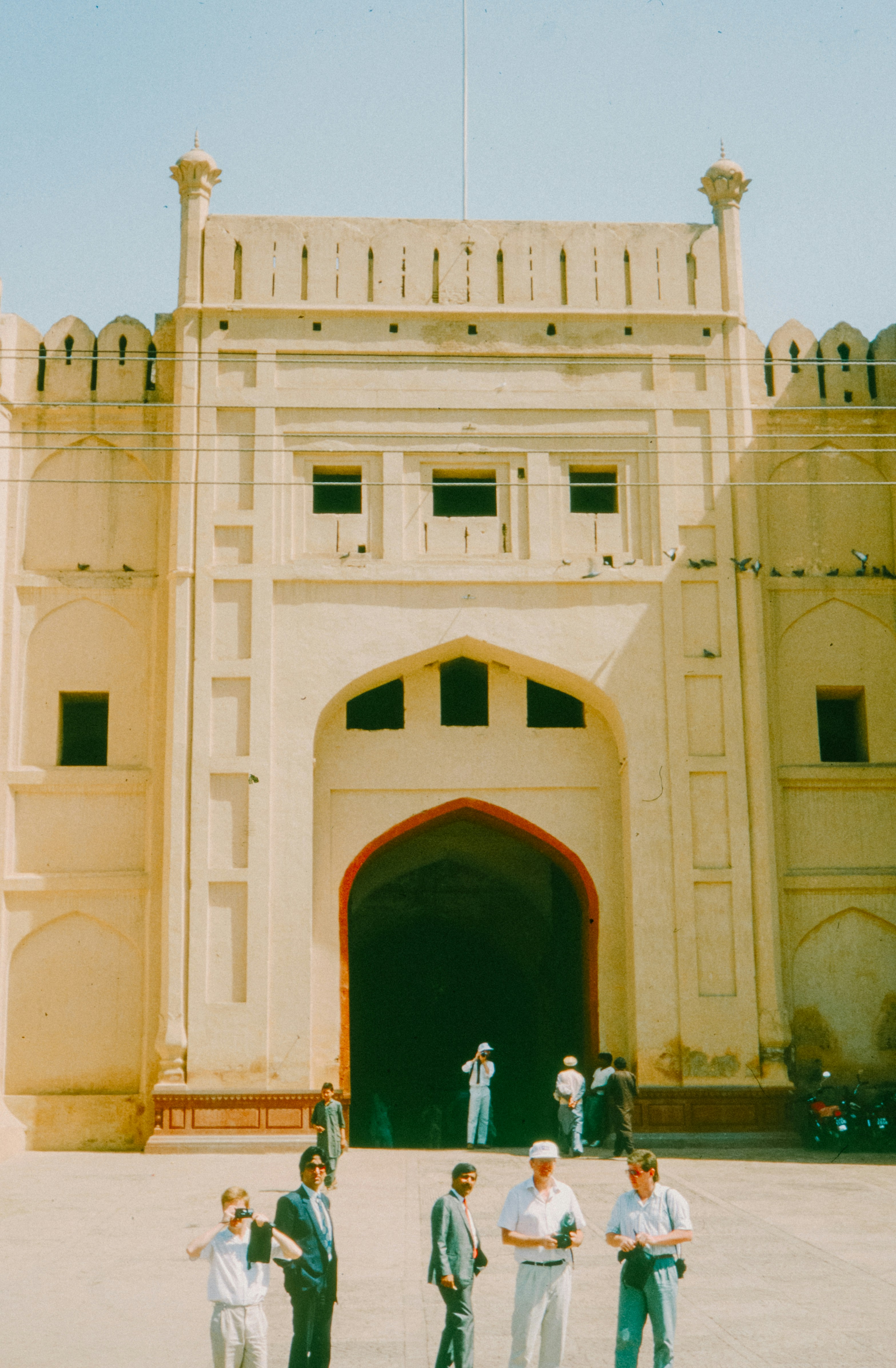 People walk through the large, ornate archway. photo – Free Vintage ...