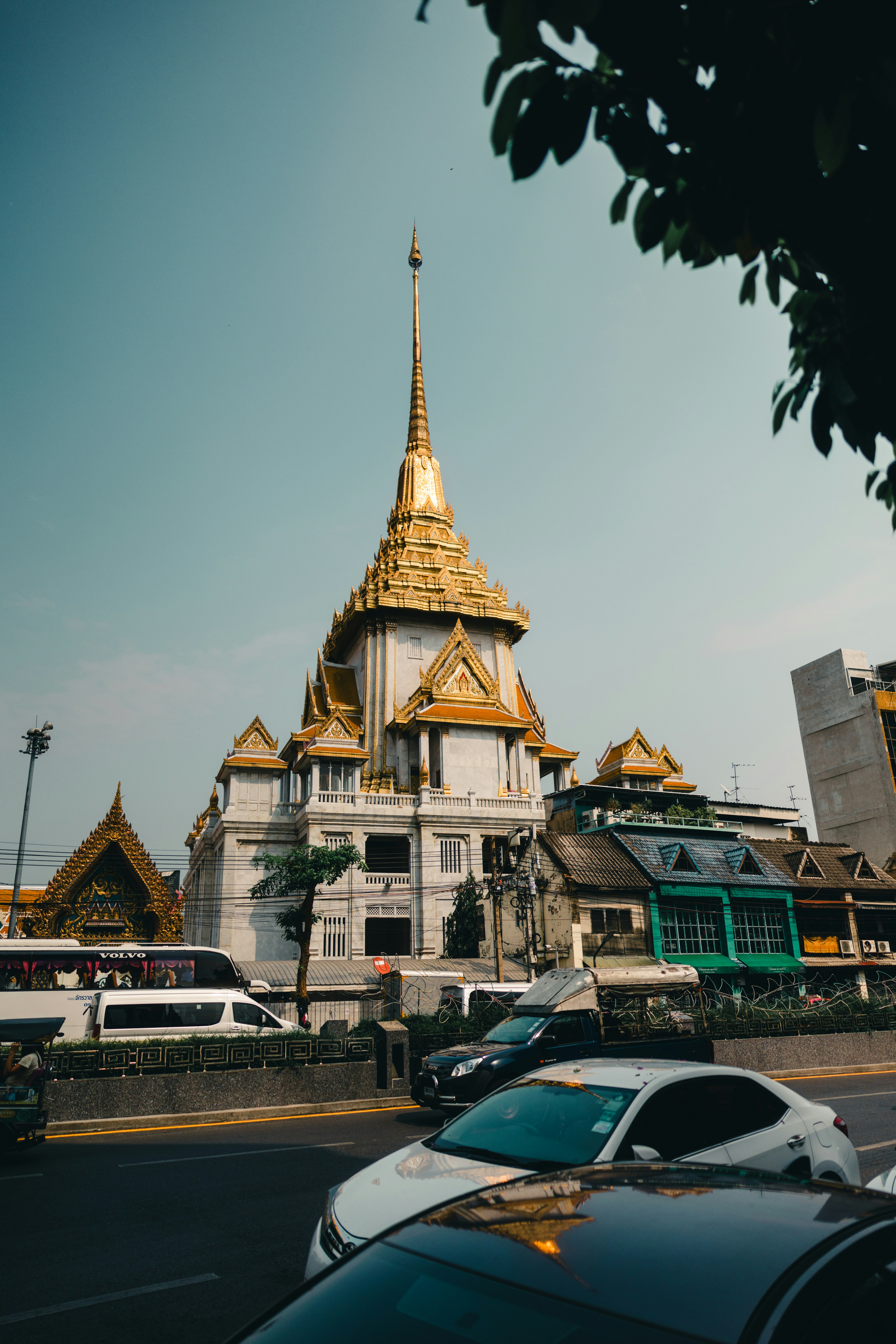 A golden-spired temple dominates the city landscape. photo – Free Car ...