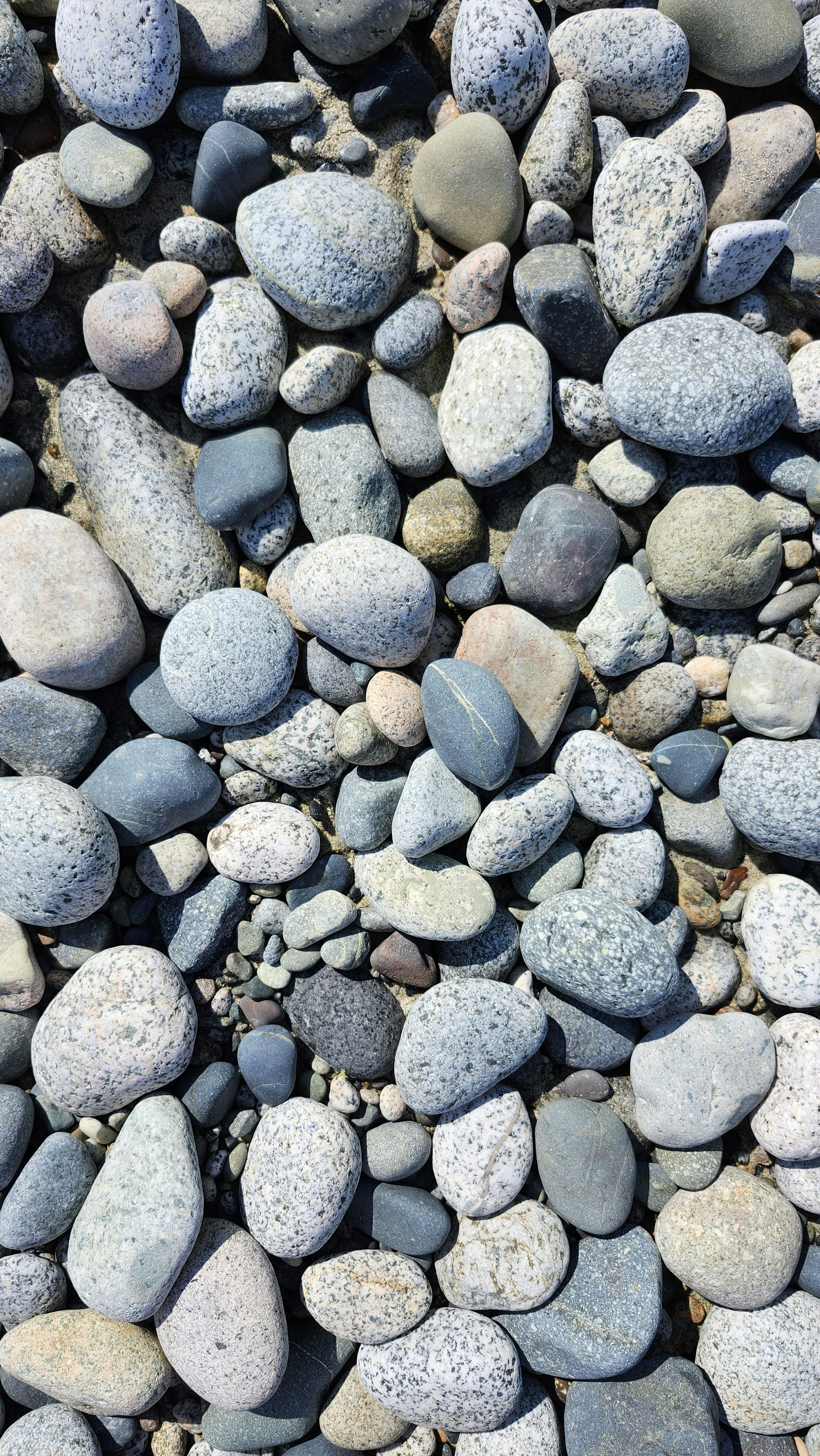 A collection of rounded rocks and pebbles. photo – Free Abstract Image ...