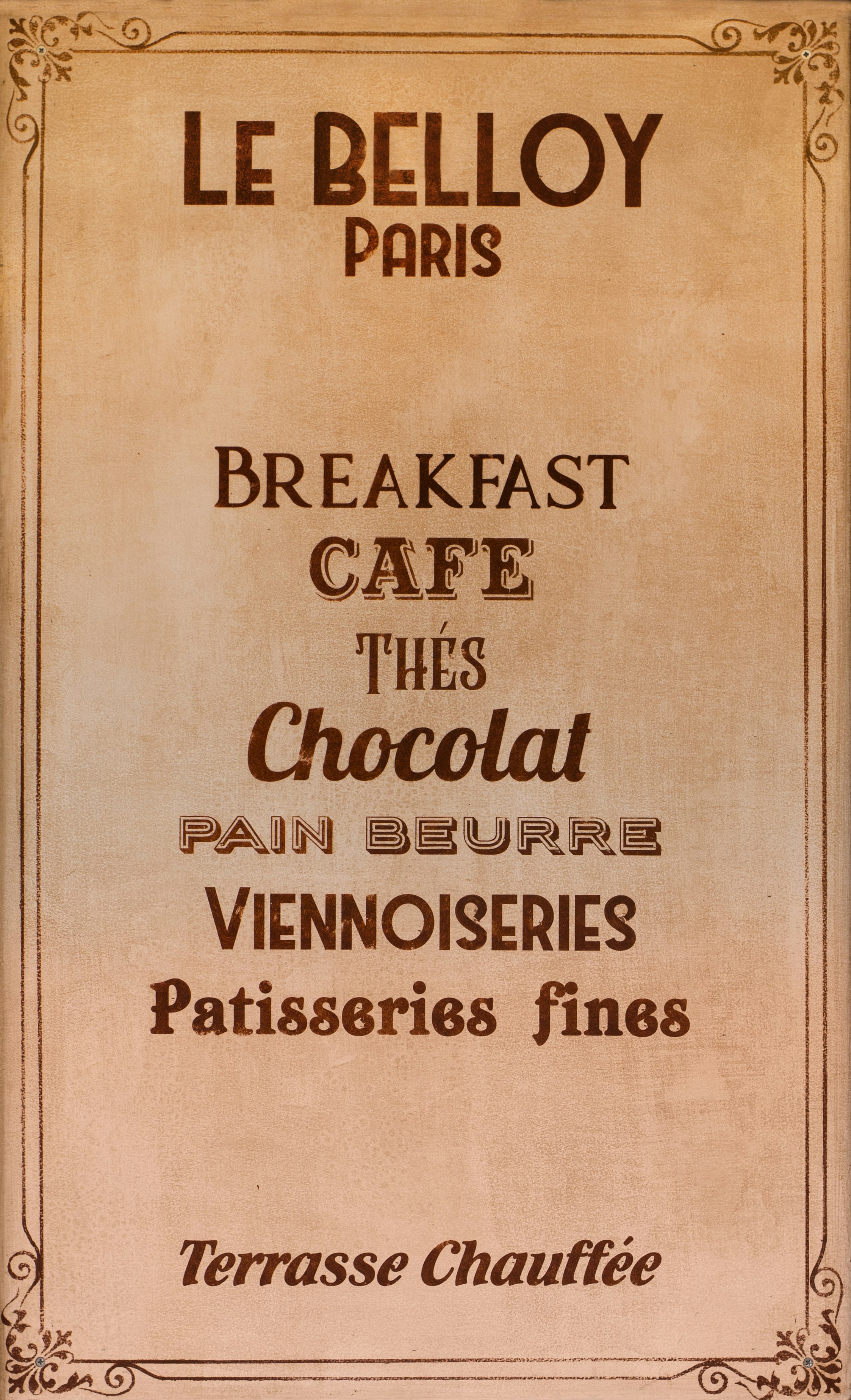 Vintage Paris café poster with ornate borders and varied French typography advertising breakfast, chocolat, and viennoiseries.