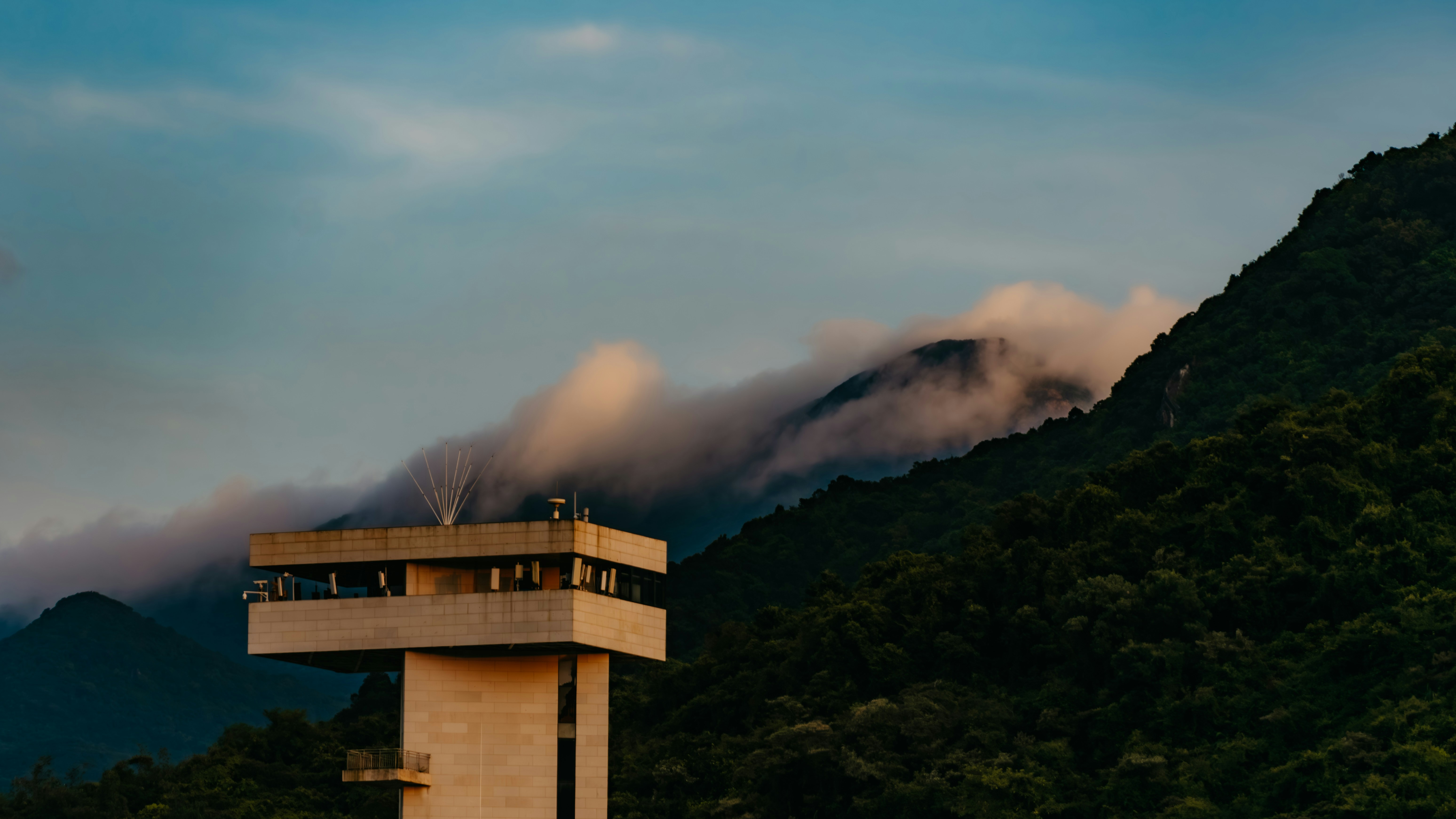 Concrete Lookout Braving Mountain Mist at Golden Hour