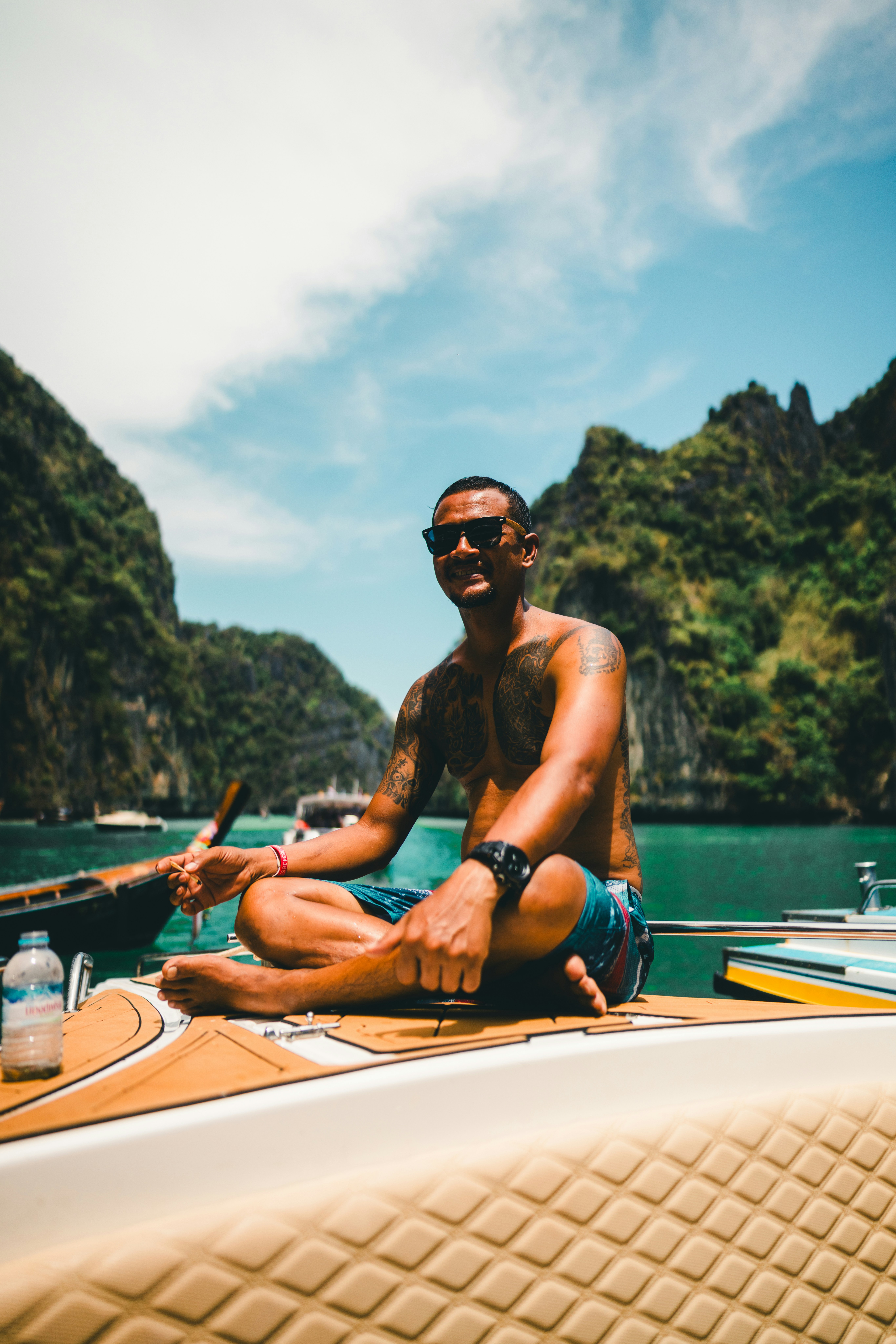 Sunlit Seafarer: A Single Moment of Calm Amid Island Carved Peaks
