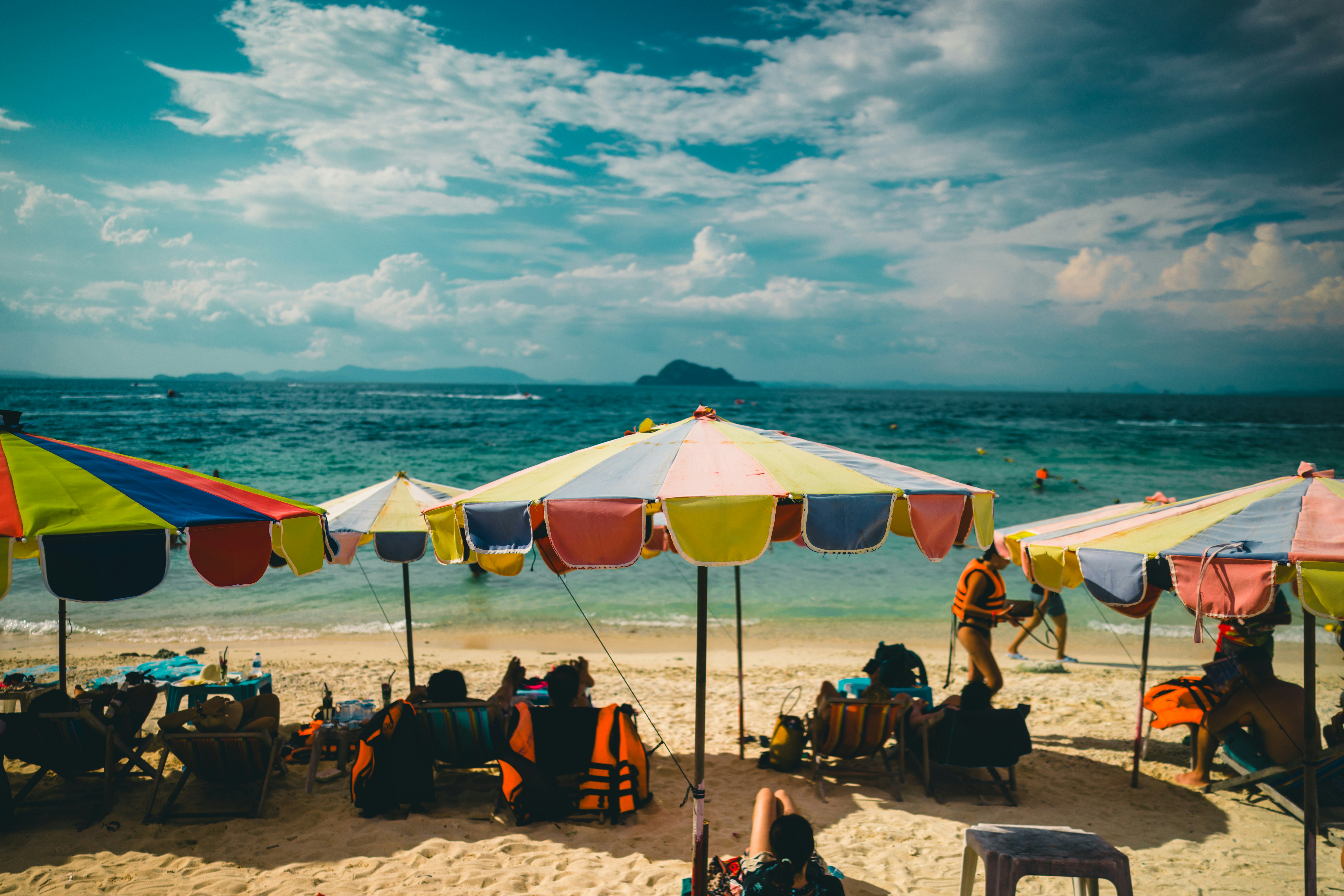 Colorful Umbrella Parade on a Busy Seaside Beach