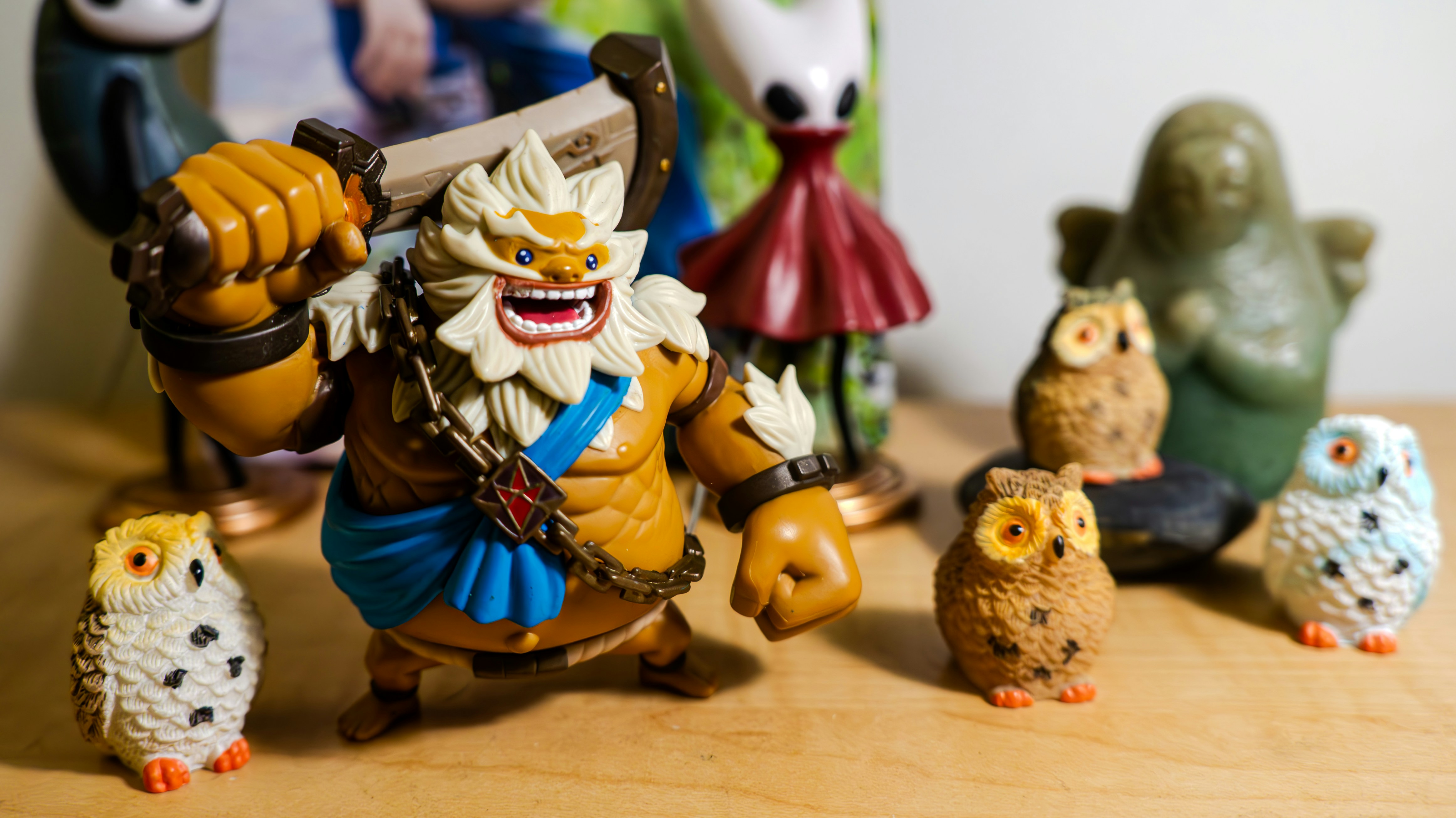 Blue-Sashed Barbarian Commands a Nest of Tiny Owls