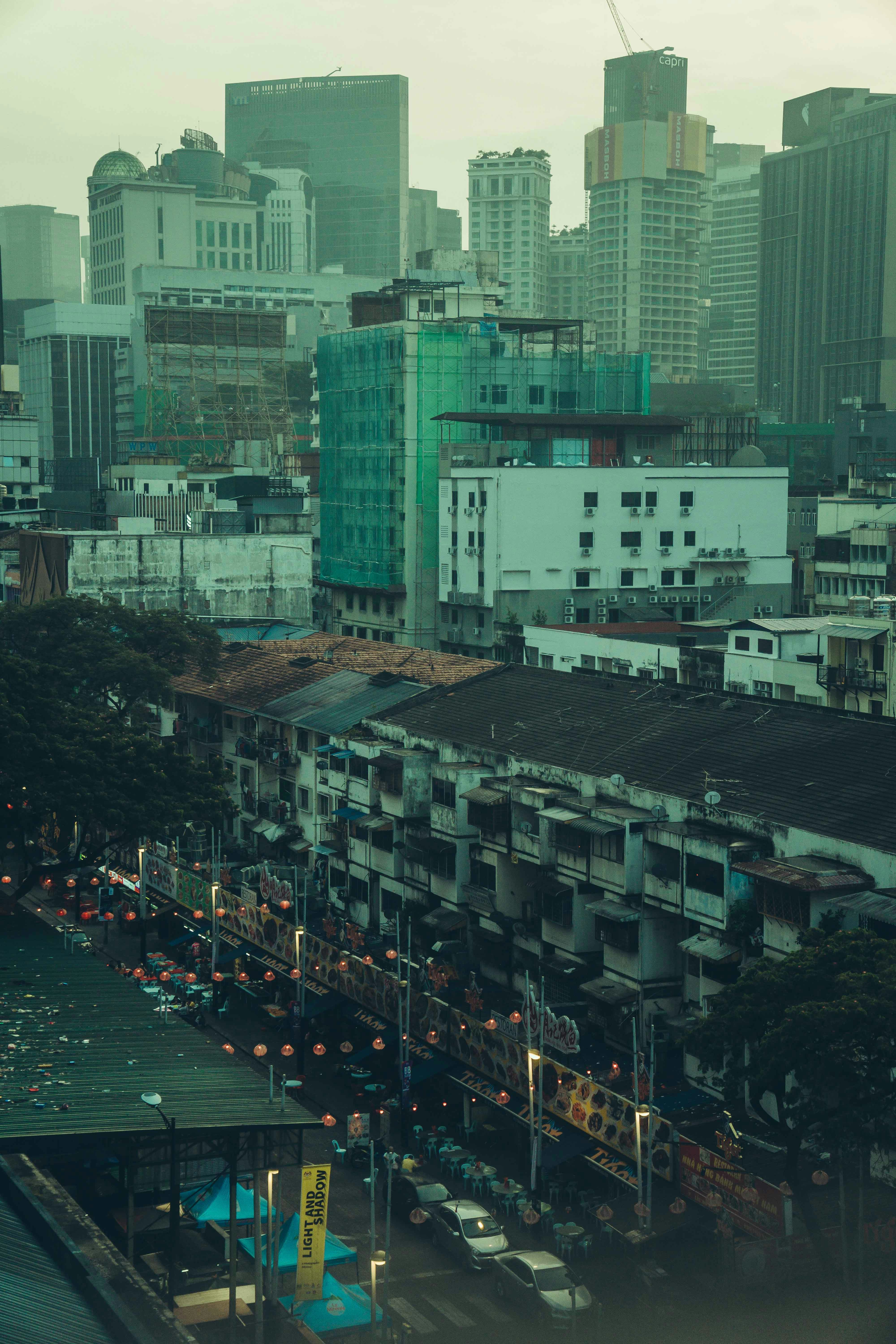 City skyline view with buildings and cars below. photo – Free Car Image ...