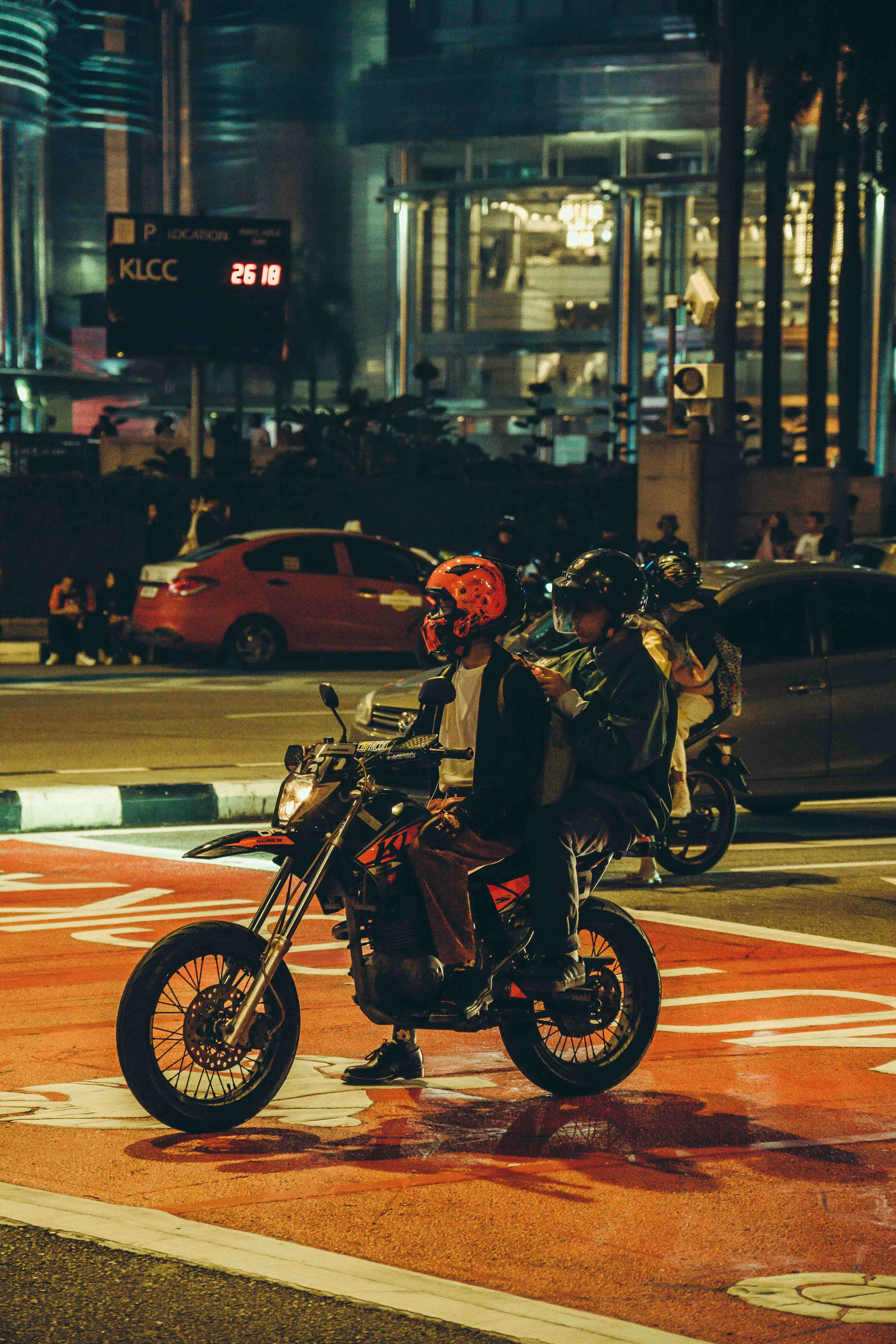 Neon-Glow Night Ride: Two Riders on a City Motorcycle