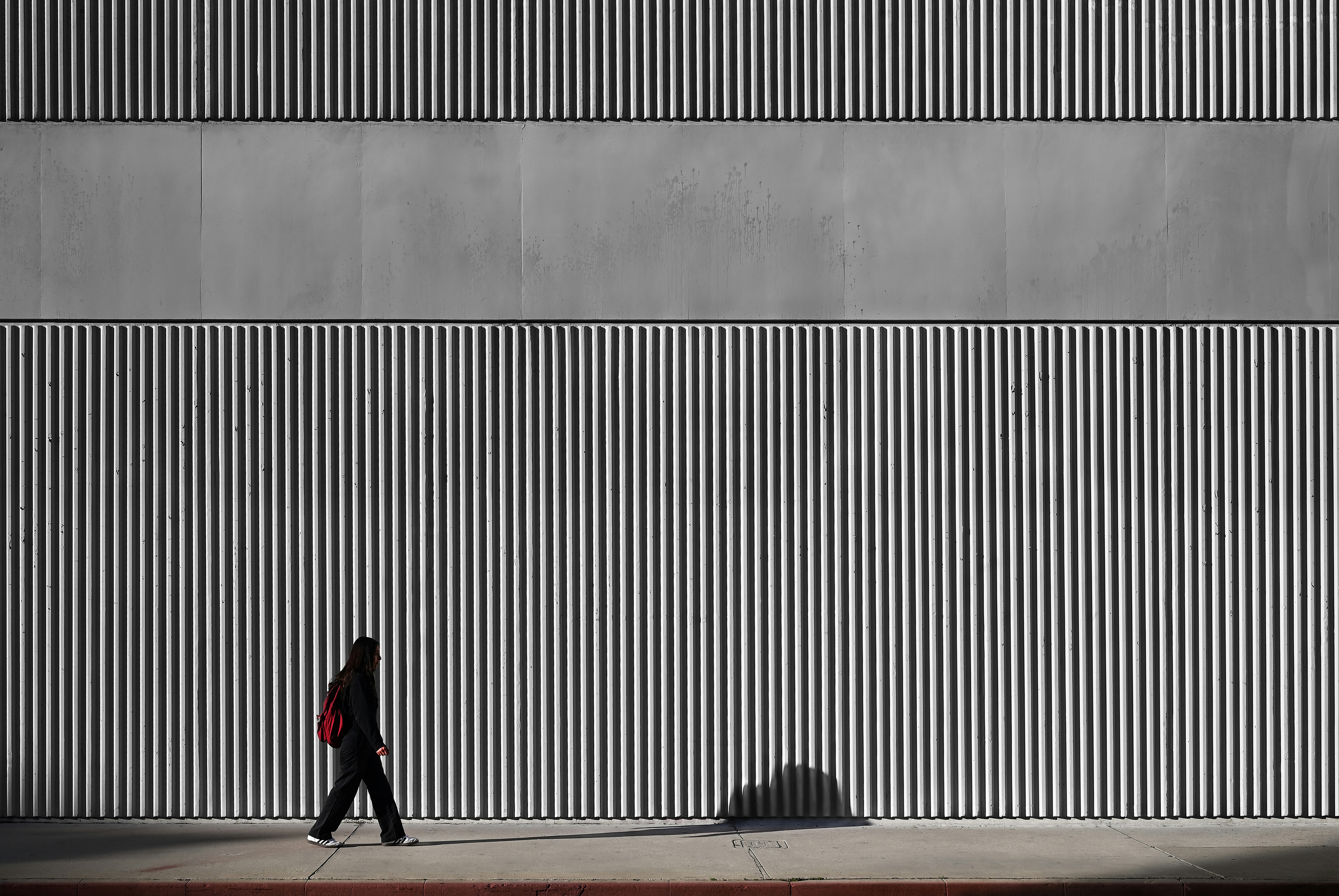 Solitary Stroll by the Striped Monolith