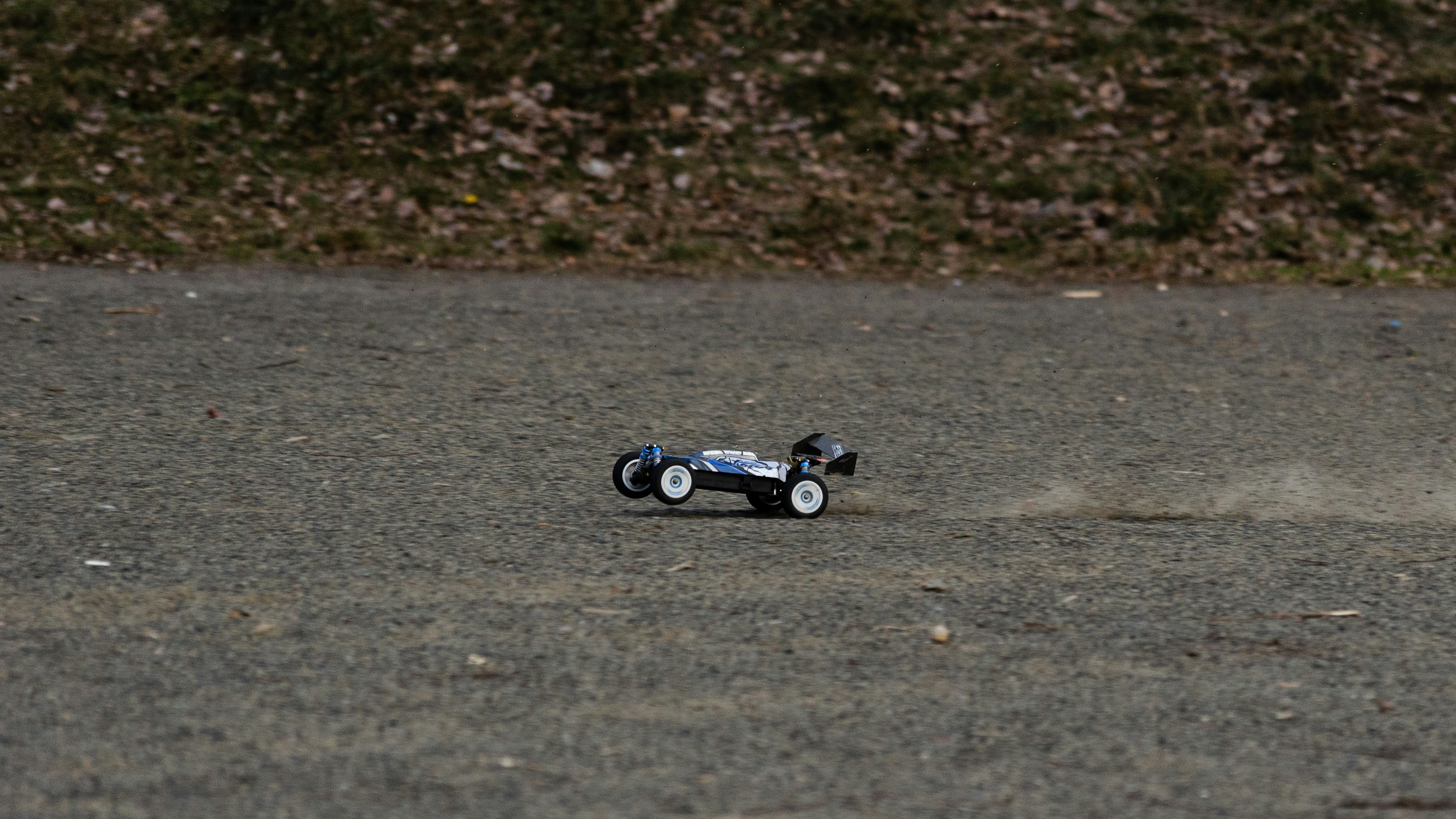 Miniature Silver RC Racer Conquers a Gravel Runway