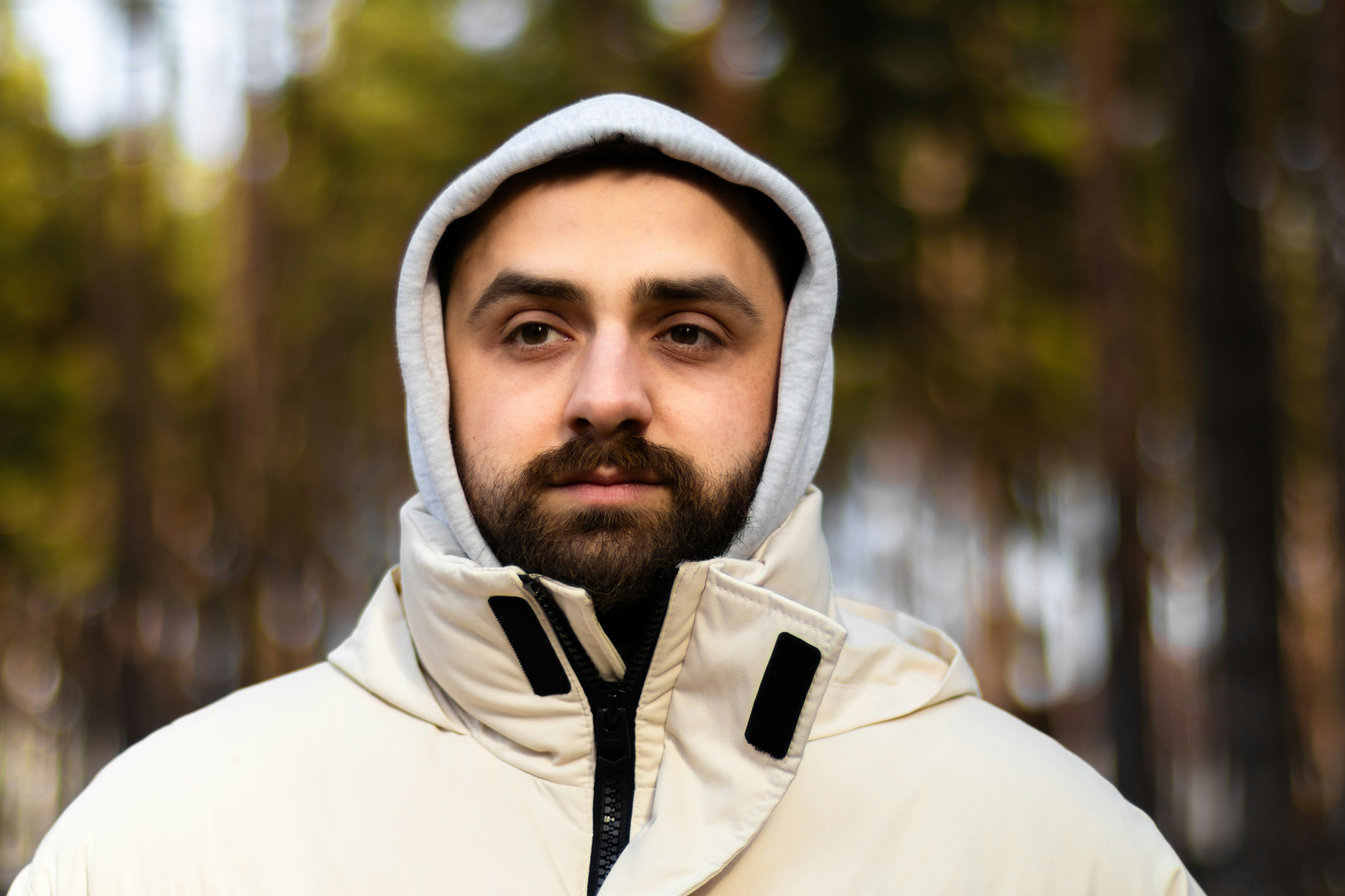 Man in a hood poses for a photo. photo – Free Man Image on Unsplash