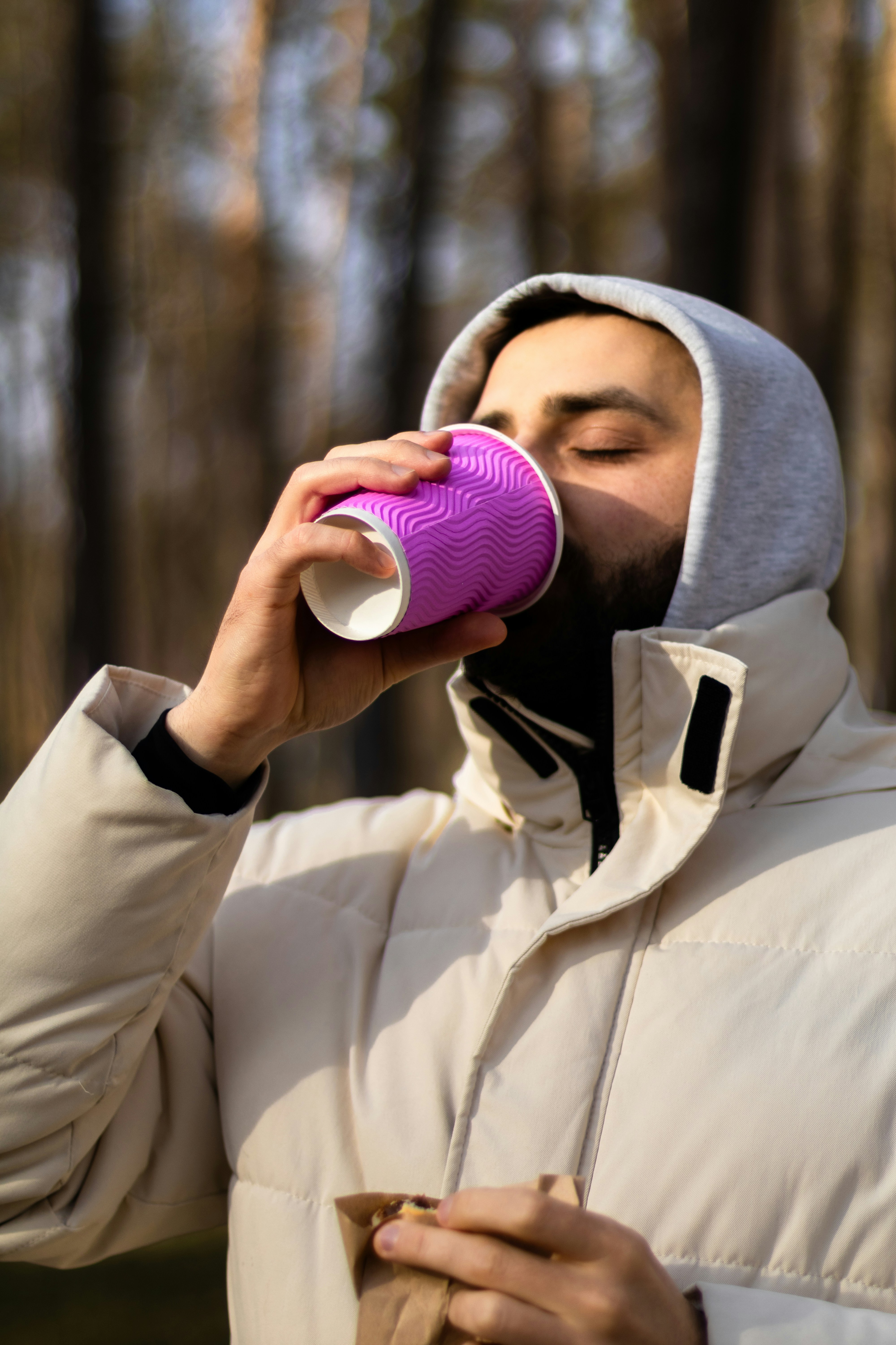 Warm Sip Under Bare Branches: A Quiet Forest Moment