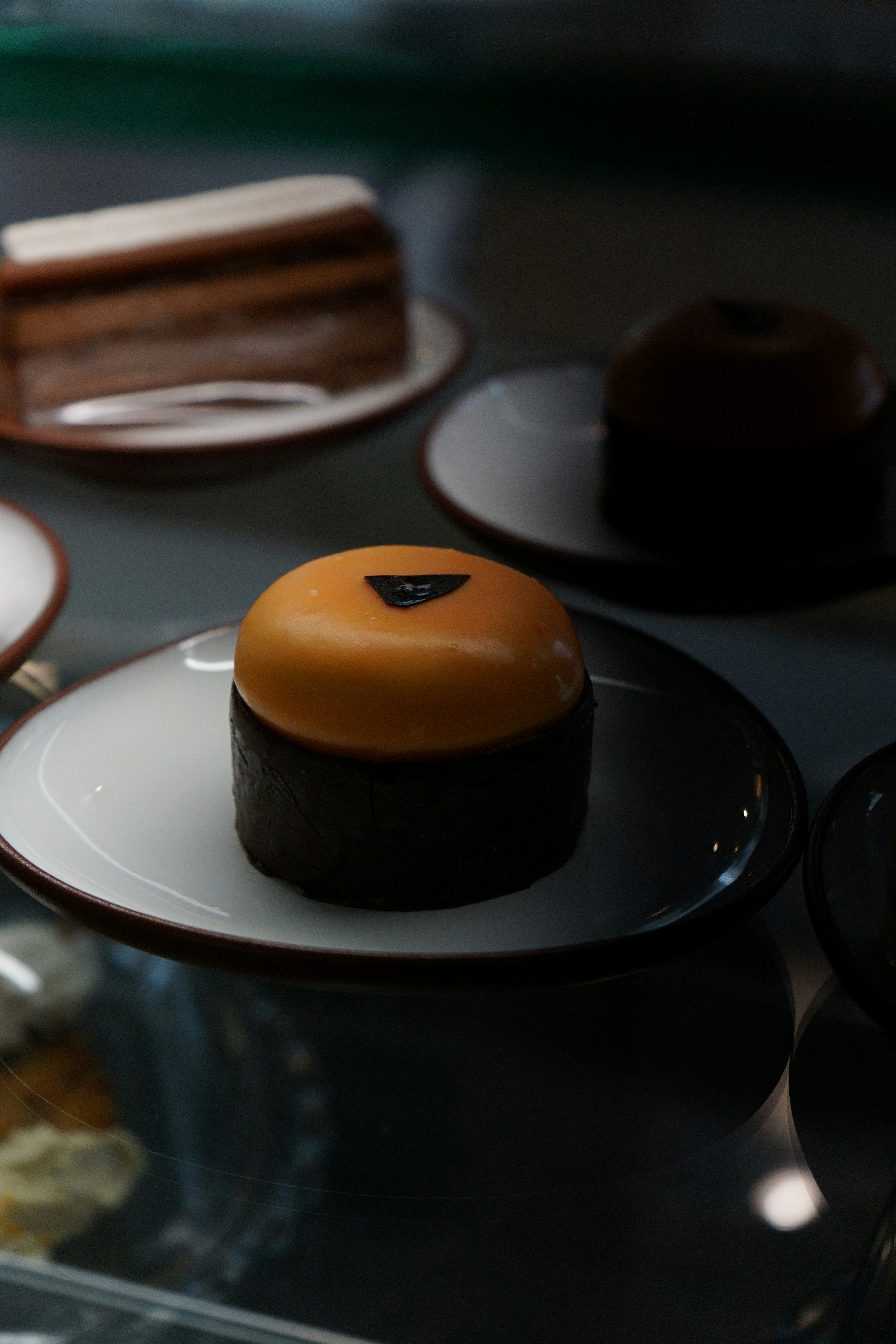 Caramel Glazed Pastry on a Dark Bakery Shelf