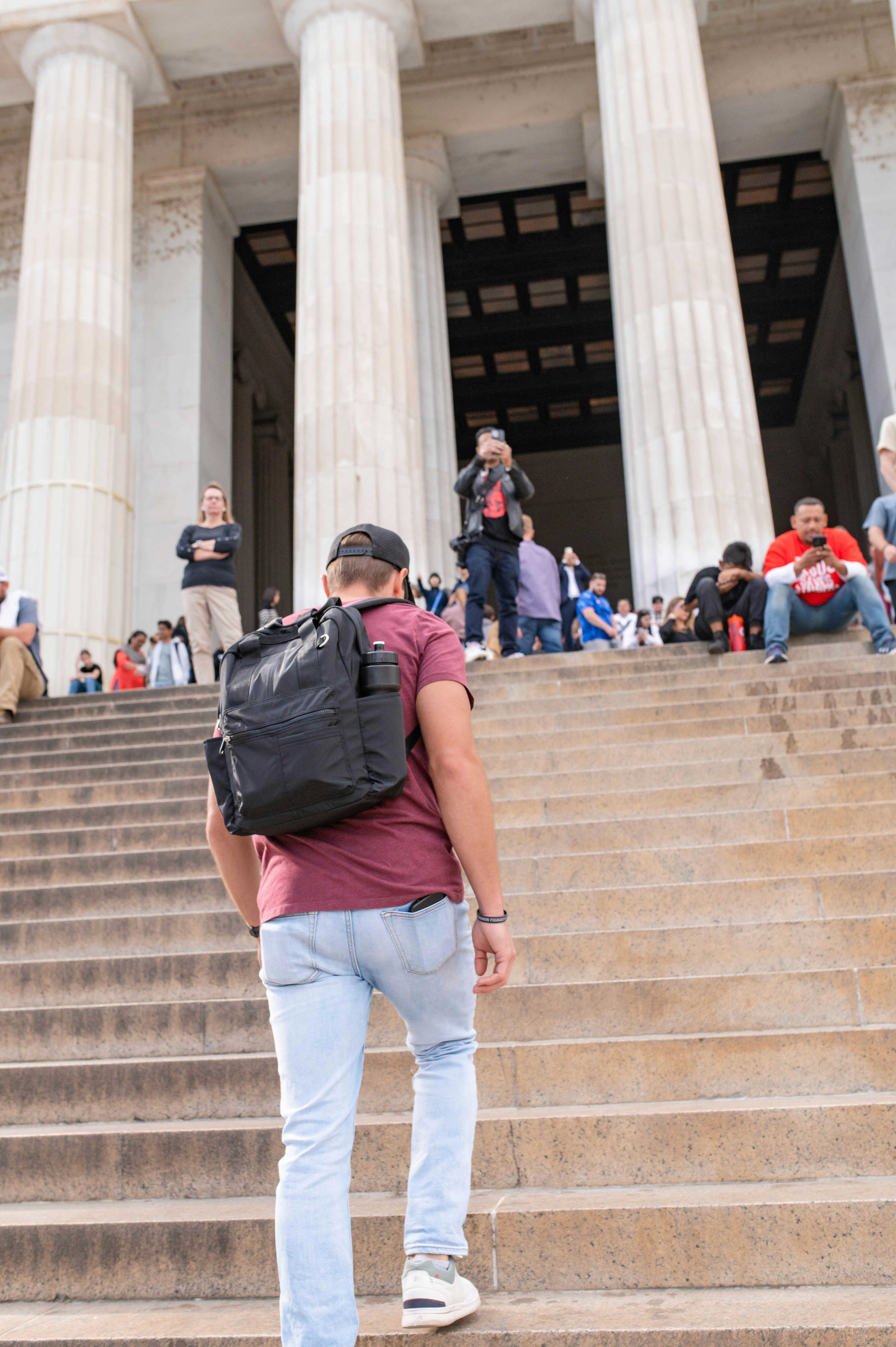 Climber’s Ascent Toward the Marble Colonnade