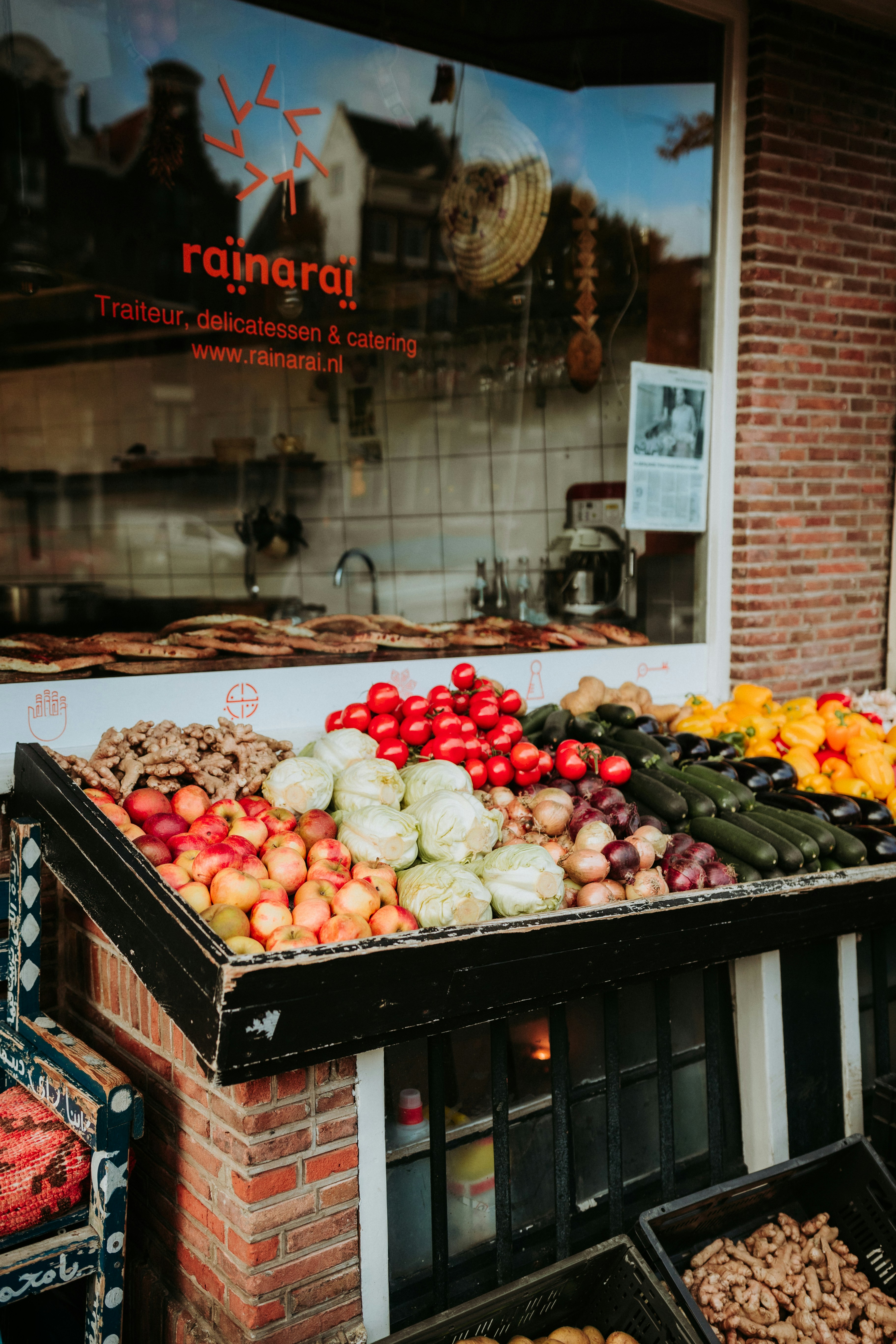 Fresh produce is displayed outside a storefront. photo – Free Food ...