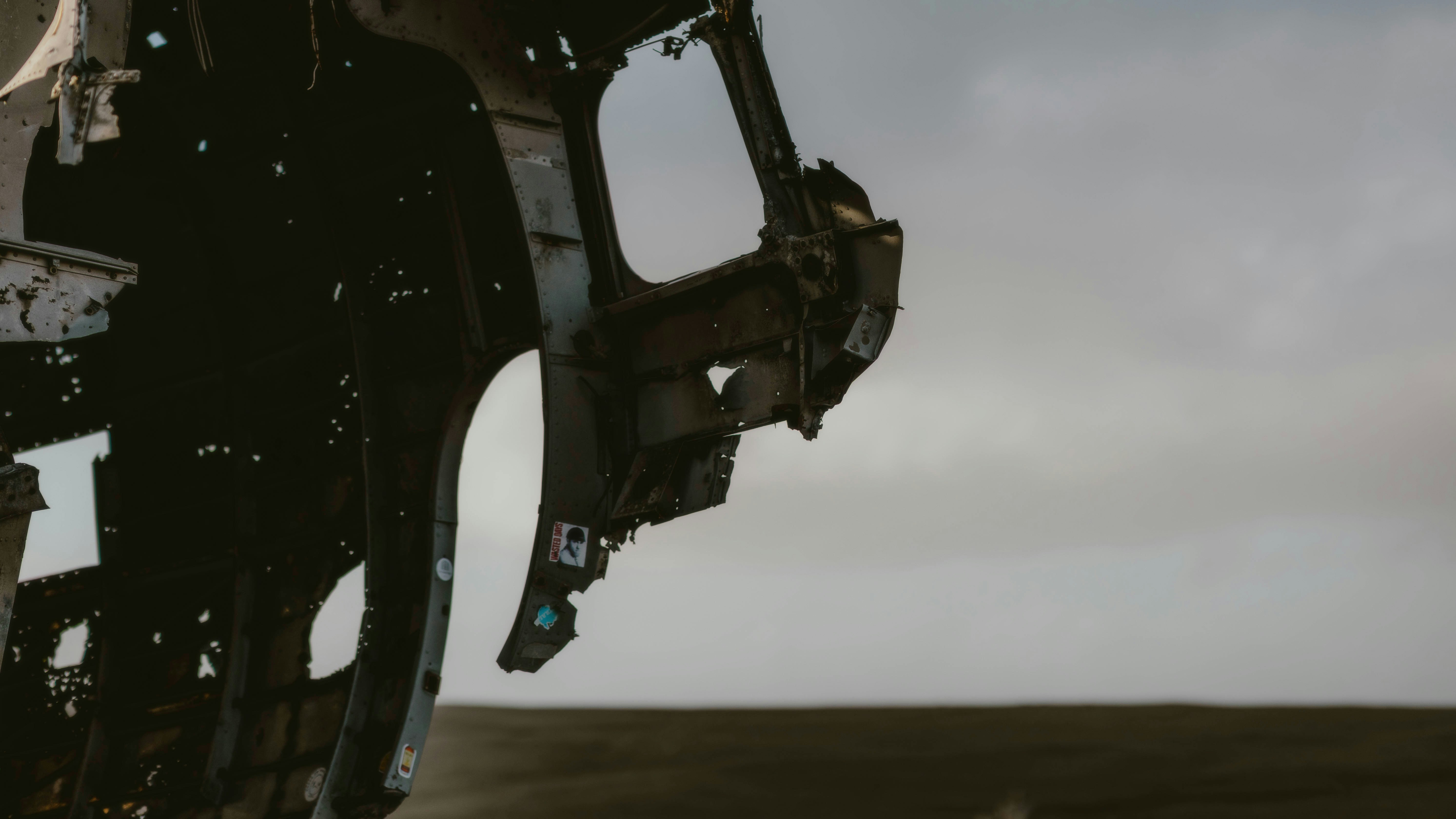 Plane wreckage against a gray sky.