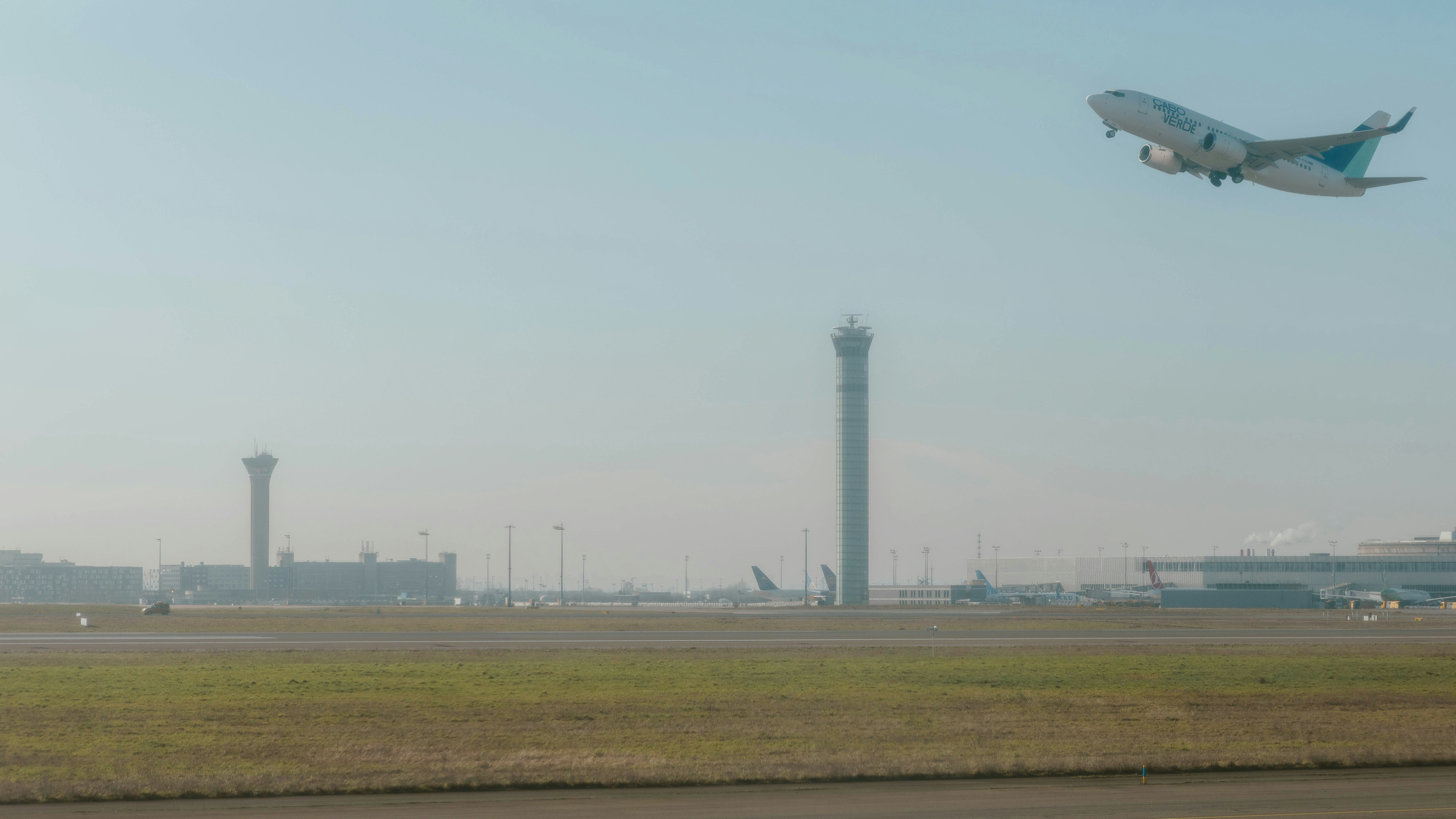 Jet Ascend Over a Hazy Horizon at a Quiet Airport