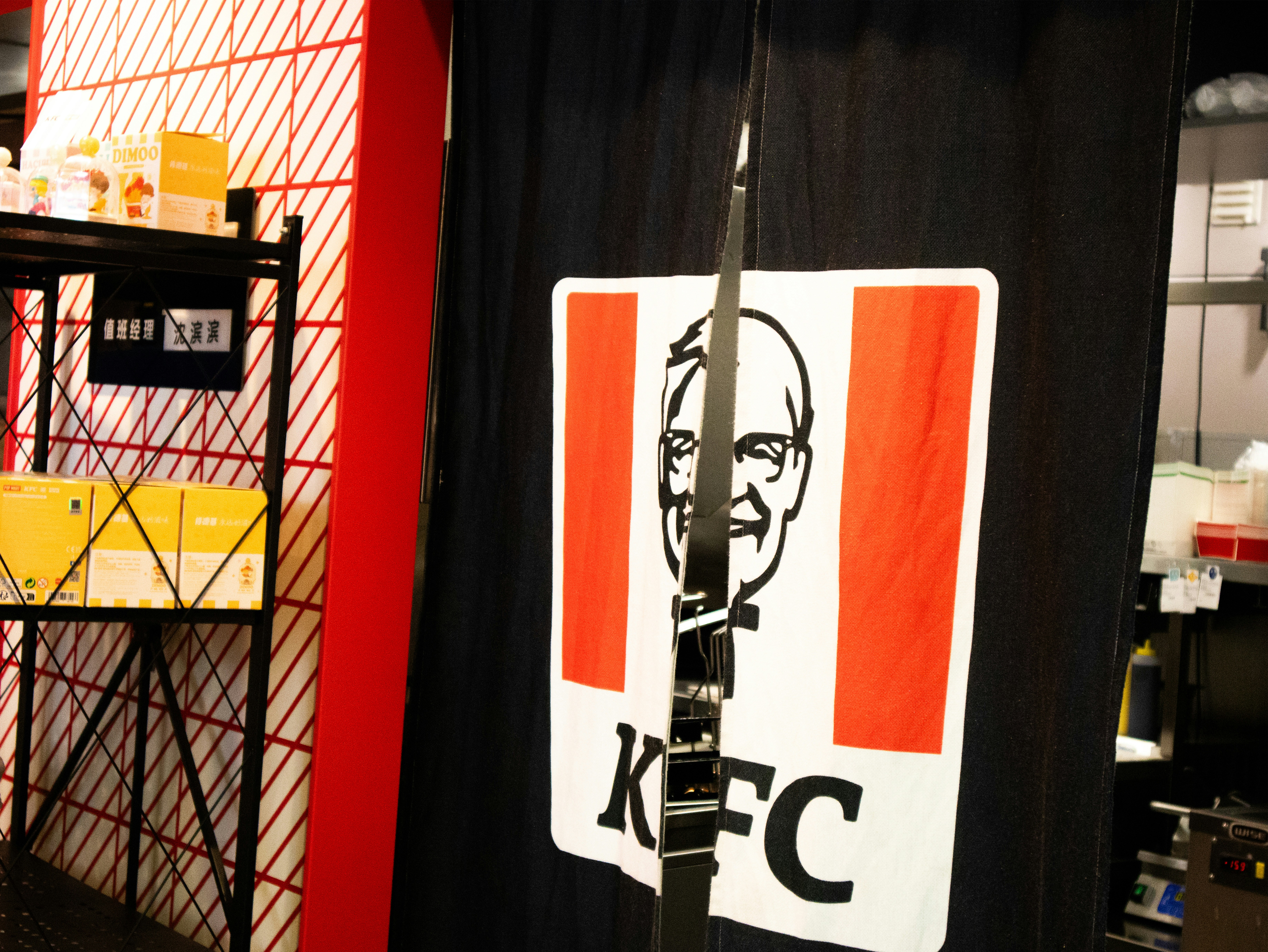 A kfc restaurant interior with a colonel sanders image. photo – Free ...
