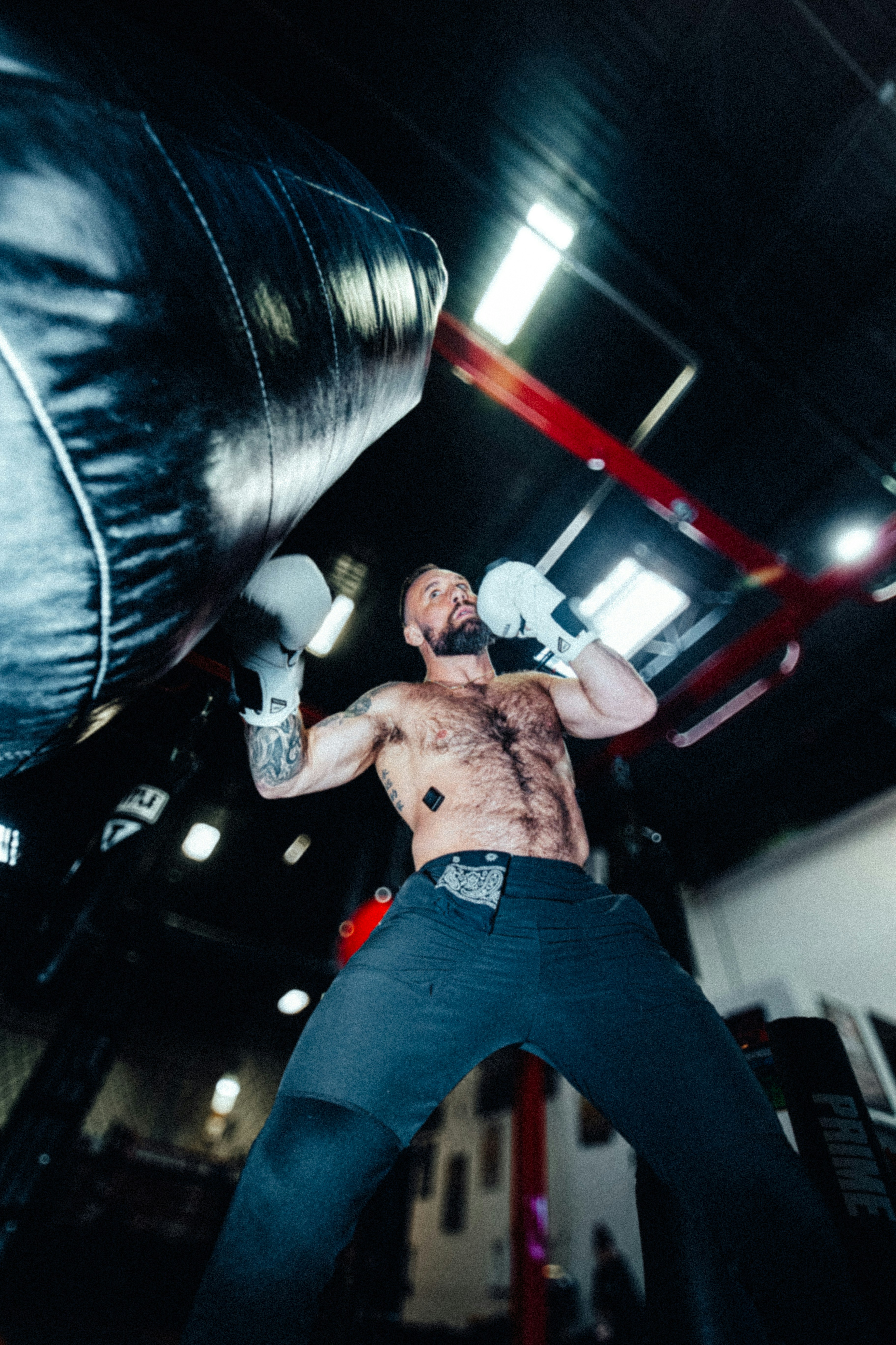 Boxer practices by hitting the heavy bag. photo – Free Man Image on ...