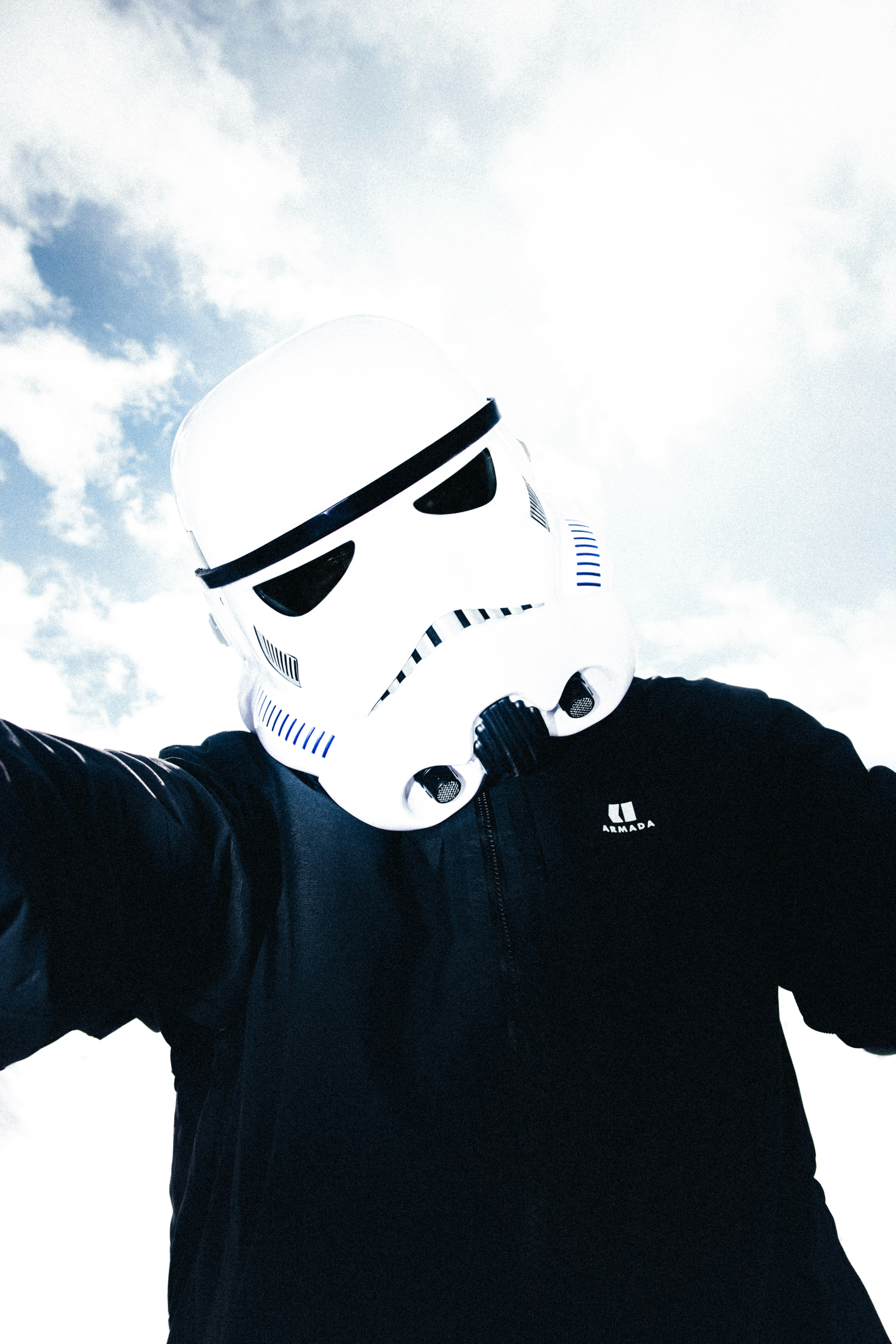 A person wearing a stormtrooper helmet outside. photo – Free Man Image ...