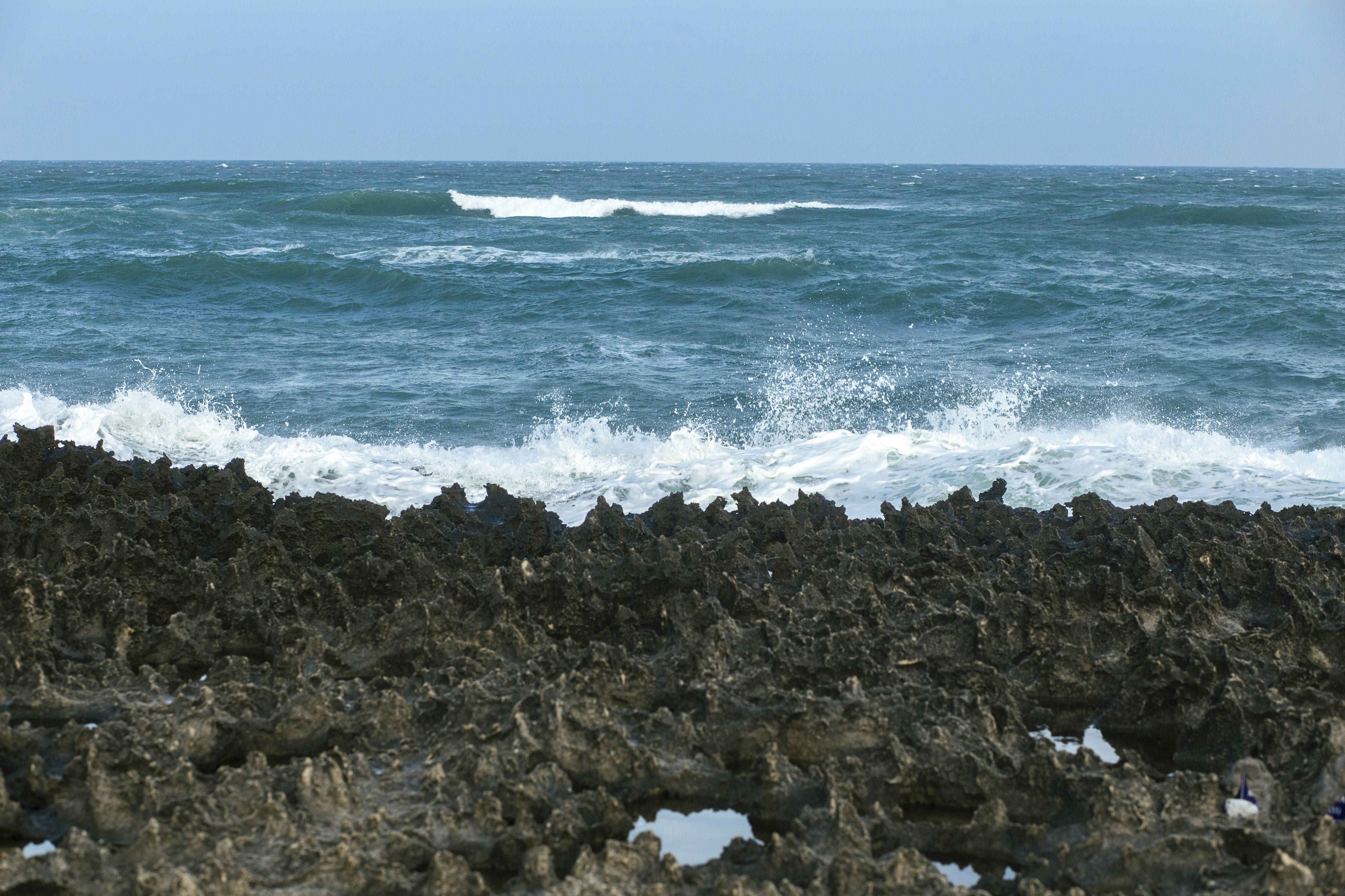 Basalt Edge: Turquoise Breakers on a Rugged Shore