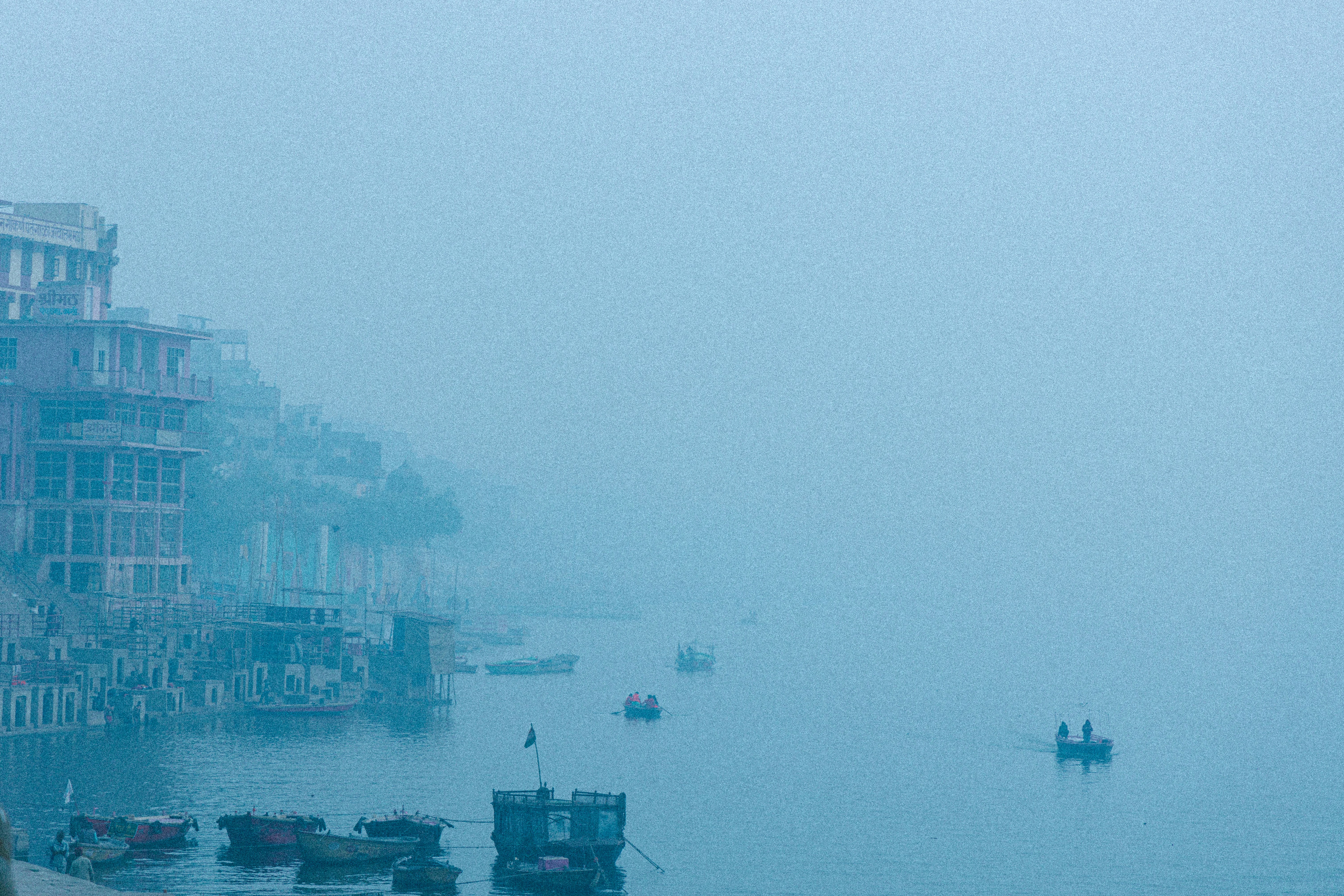 Mist-Locked Waterfront: Boats and Buildings in Blue Haze